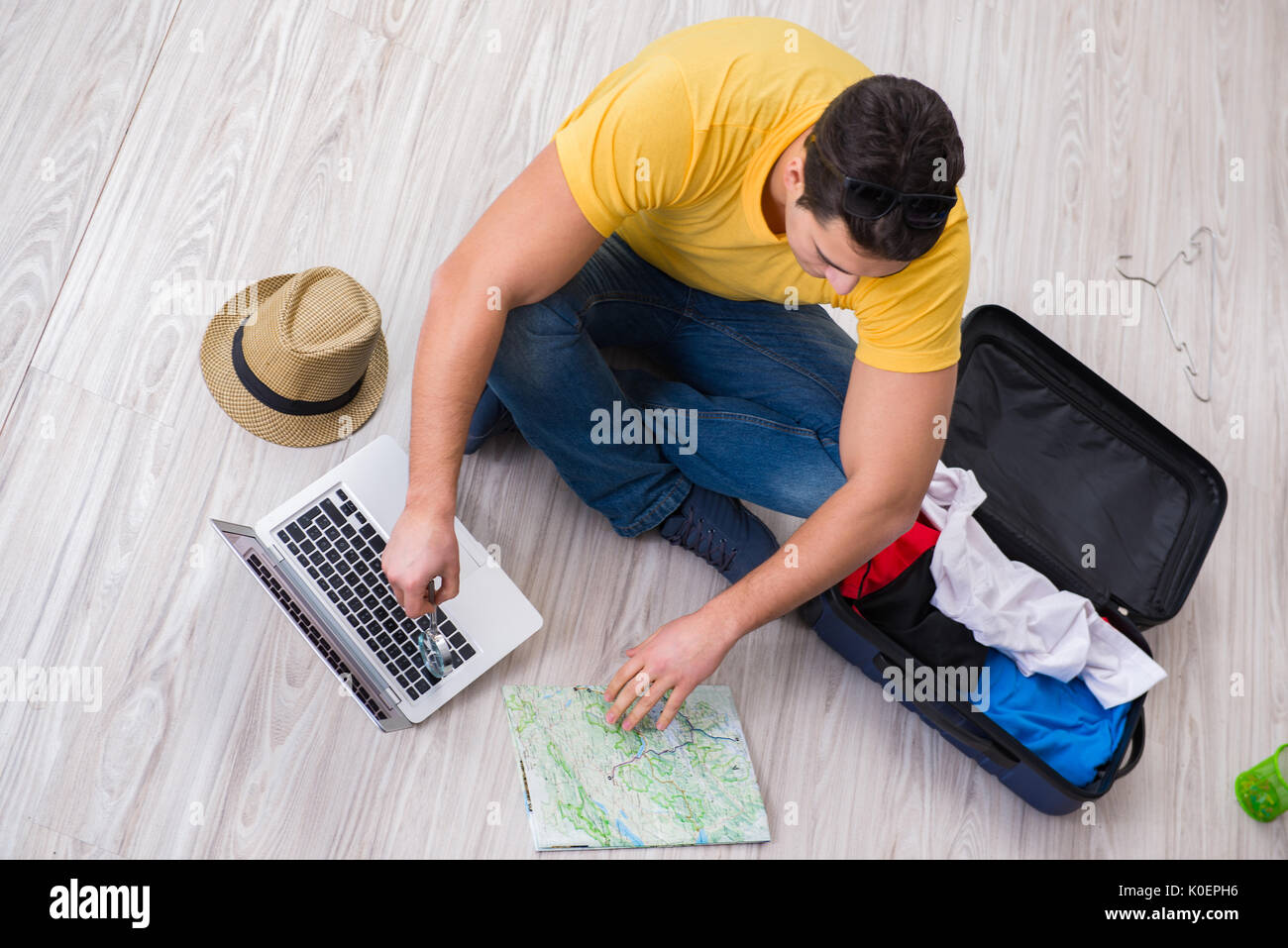Man planning his vacation trip with map Stock Photo - Alamy