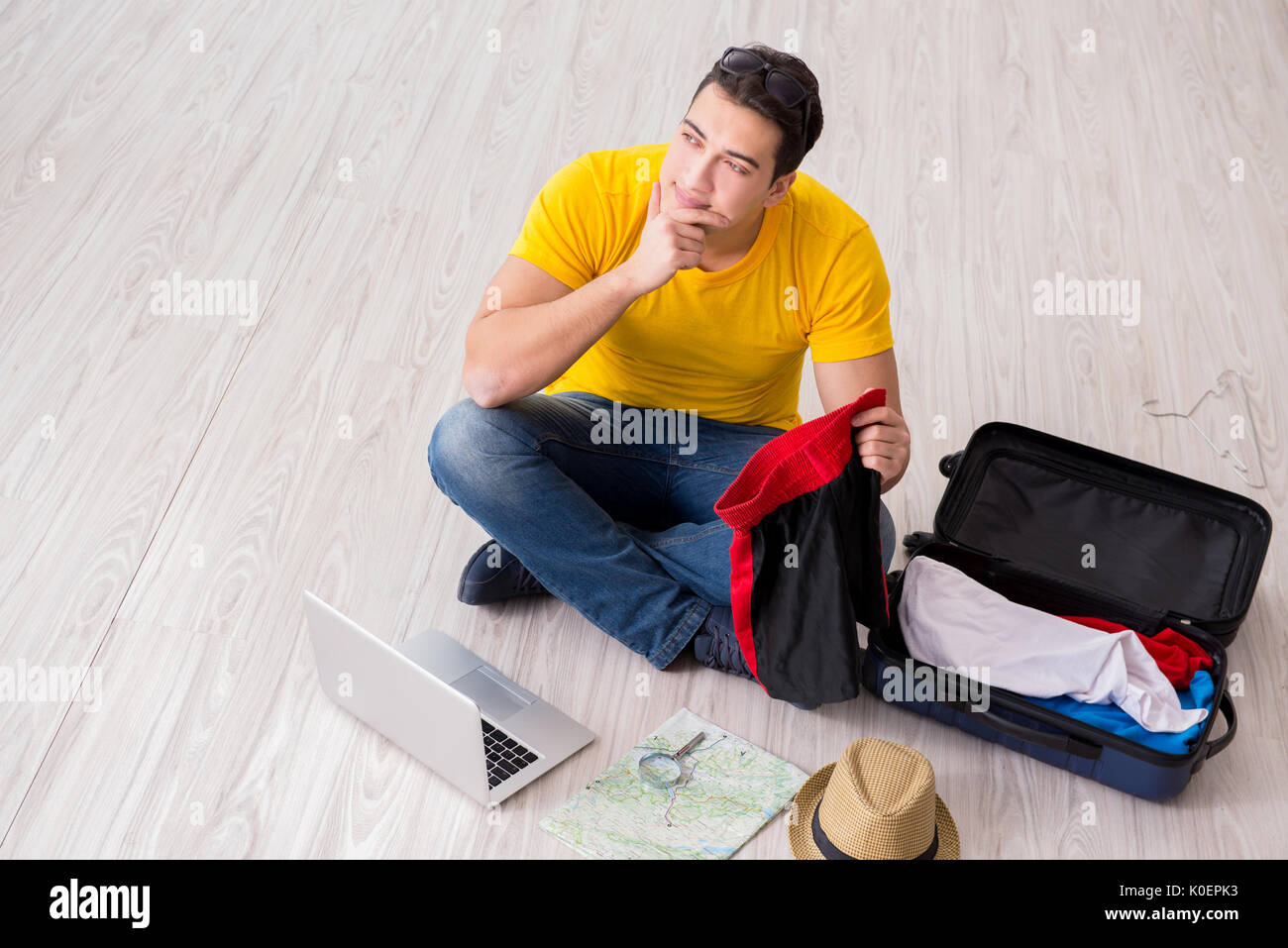 Man planning his vacation trip with map Stock Photo - Alamy