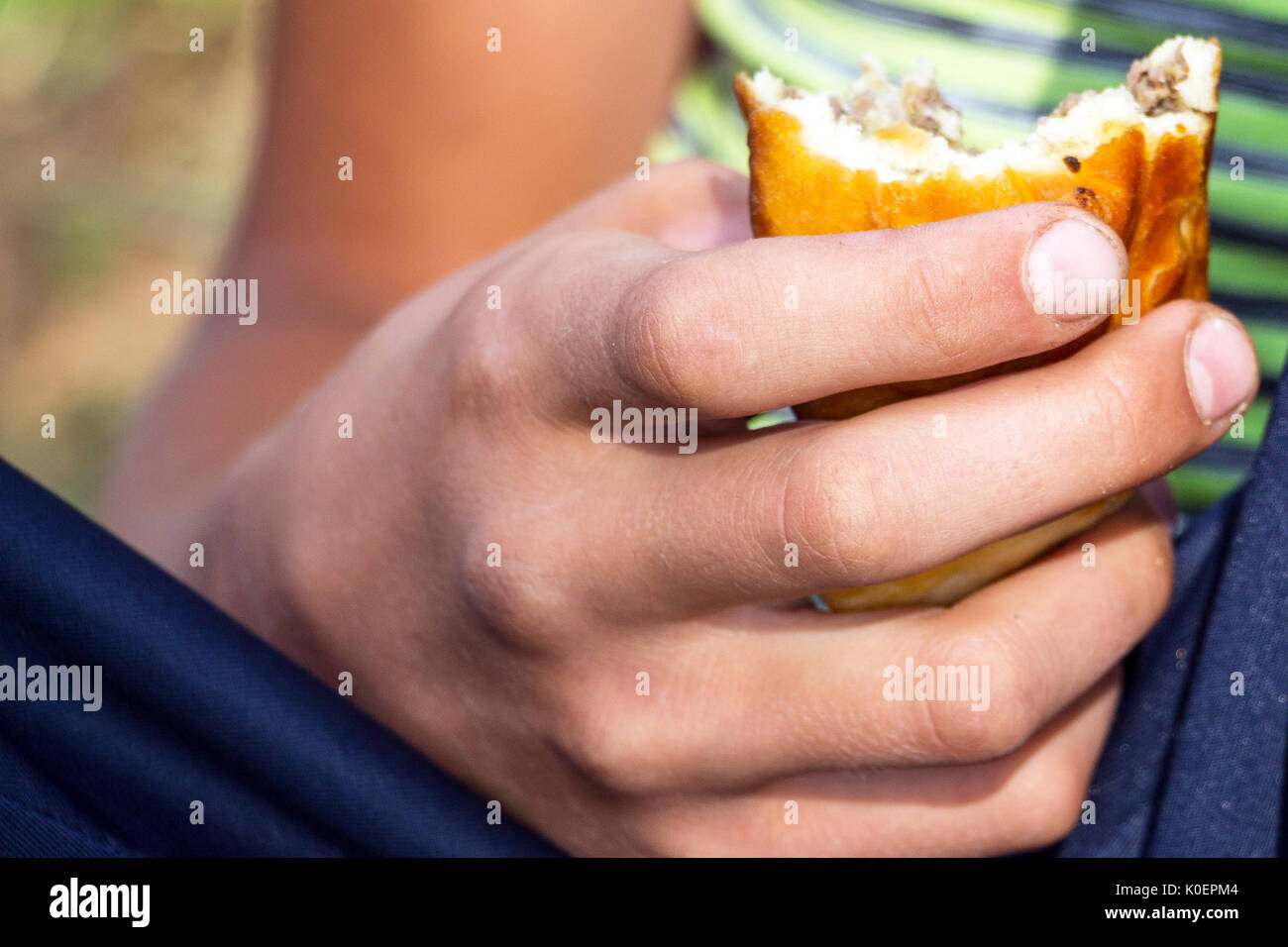 Half eaten food eating hand hi-res stock photography and images - Alamy