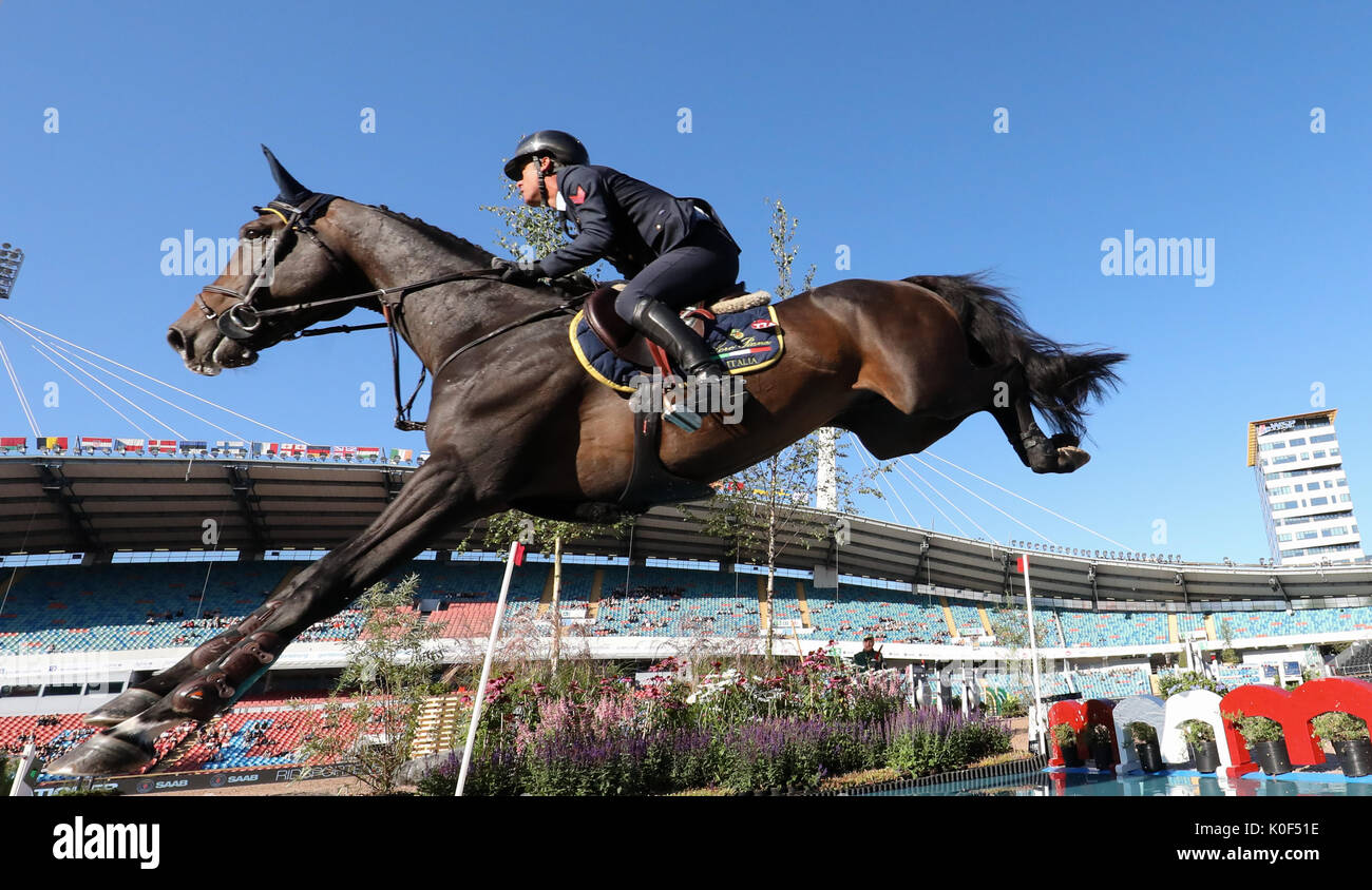 Italian show jumper Luca Marziani on his horse Tokyo du Soleil going ...