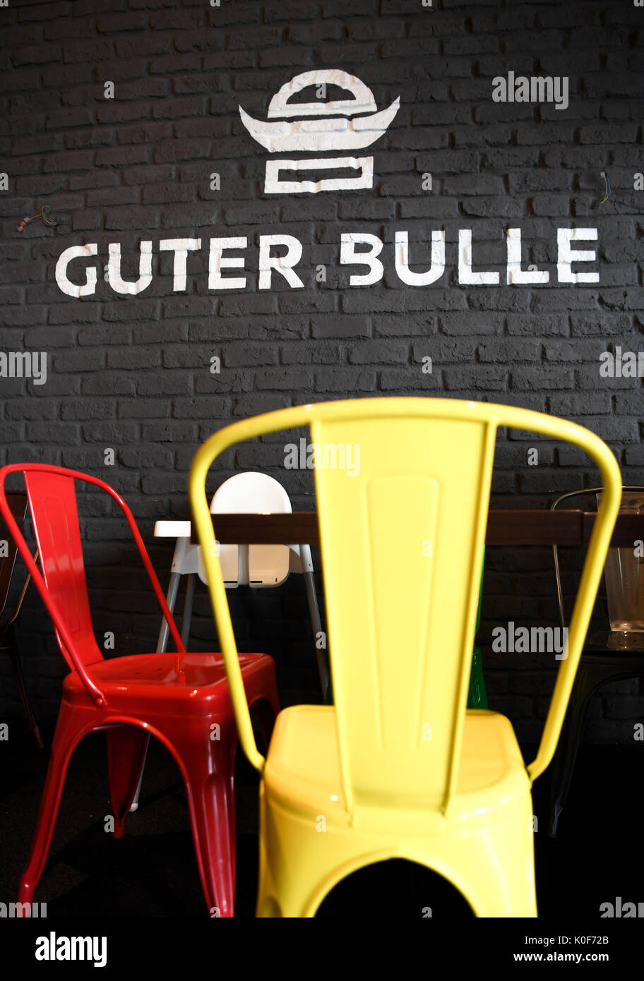 Lettering reads "Guter Bulle" on the wall of a burger restaurant of the ...