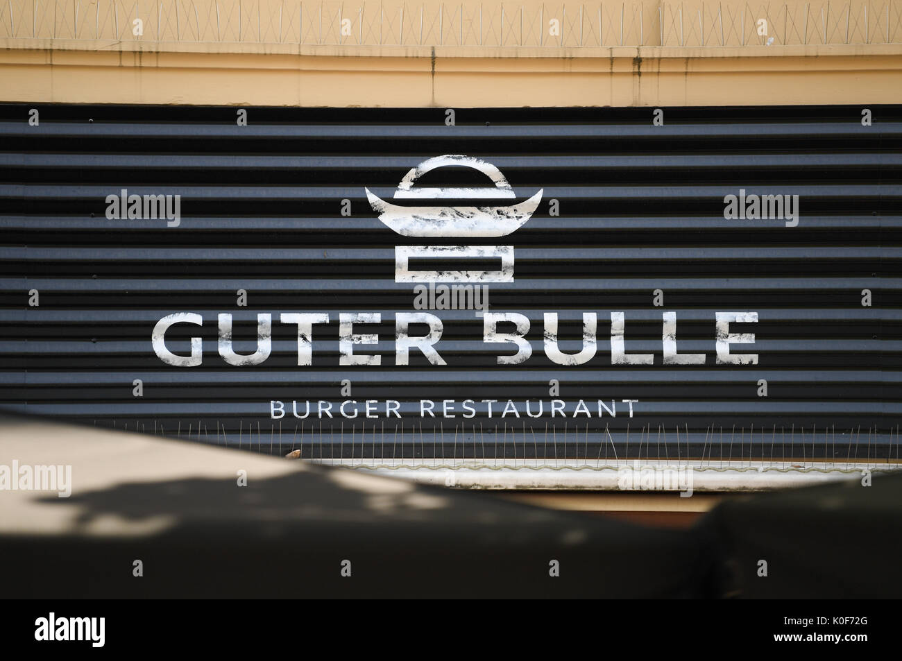 Lettering reads "Guter Bulle" on the wall of a burger restaurant of the ...