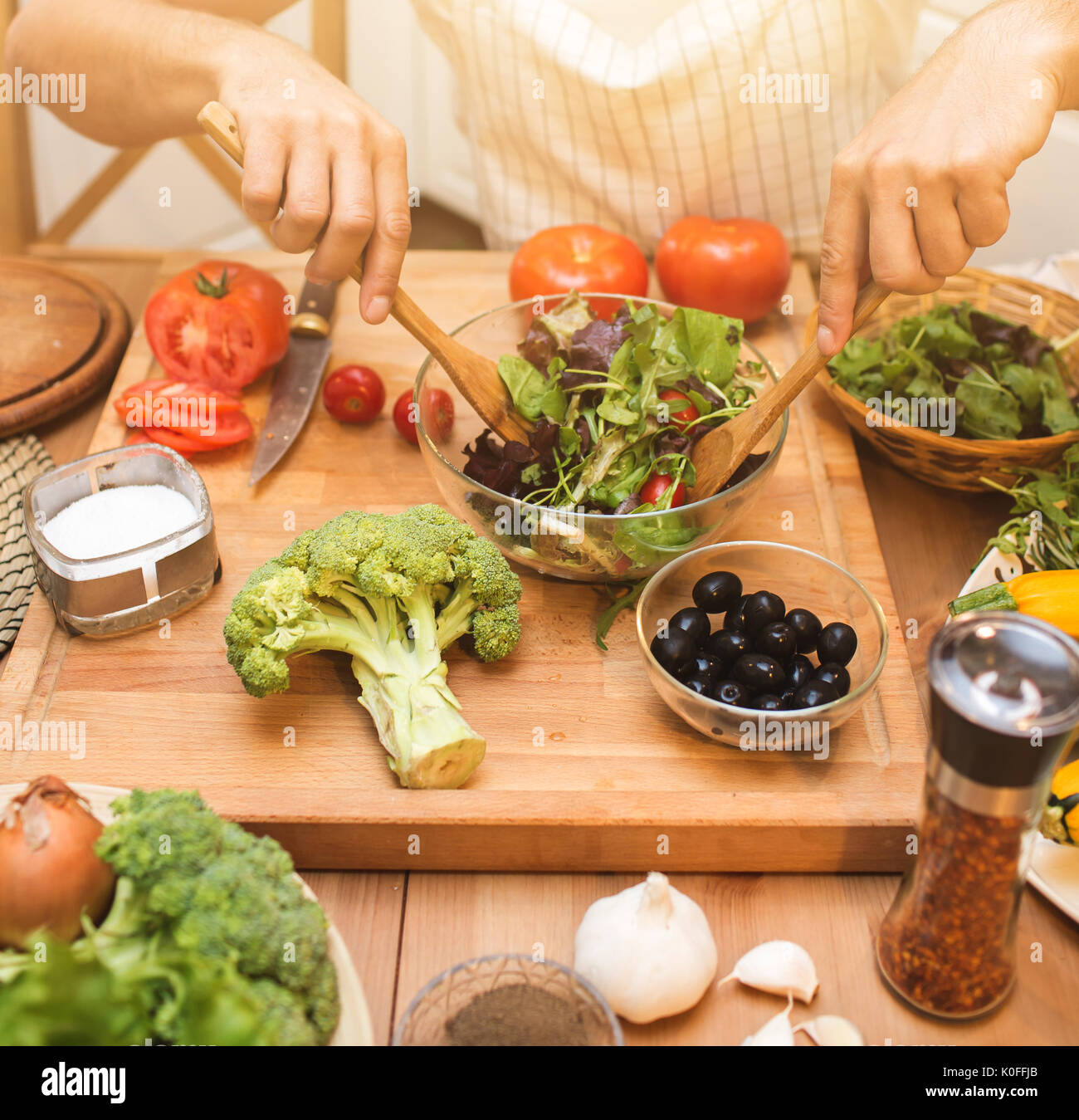 Chef man cooking salad in the kitchen Stock Photo - Alamy