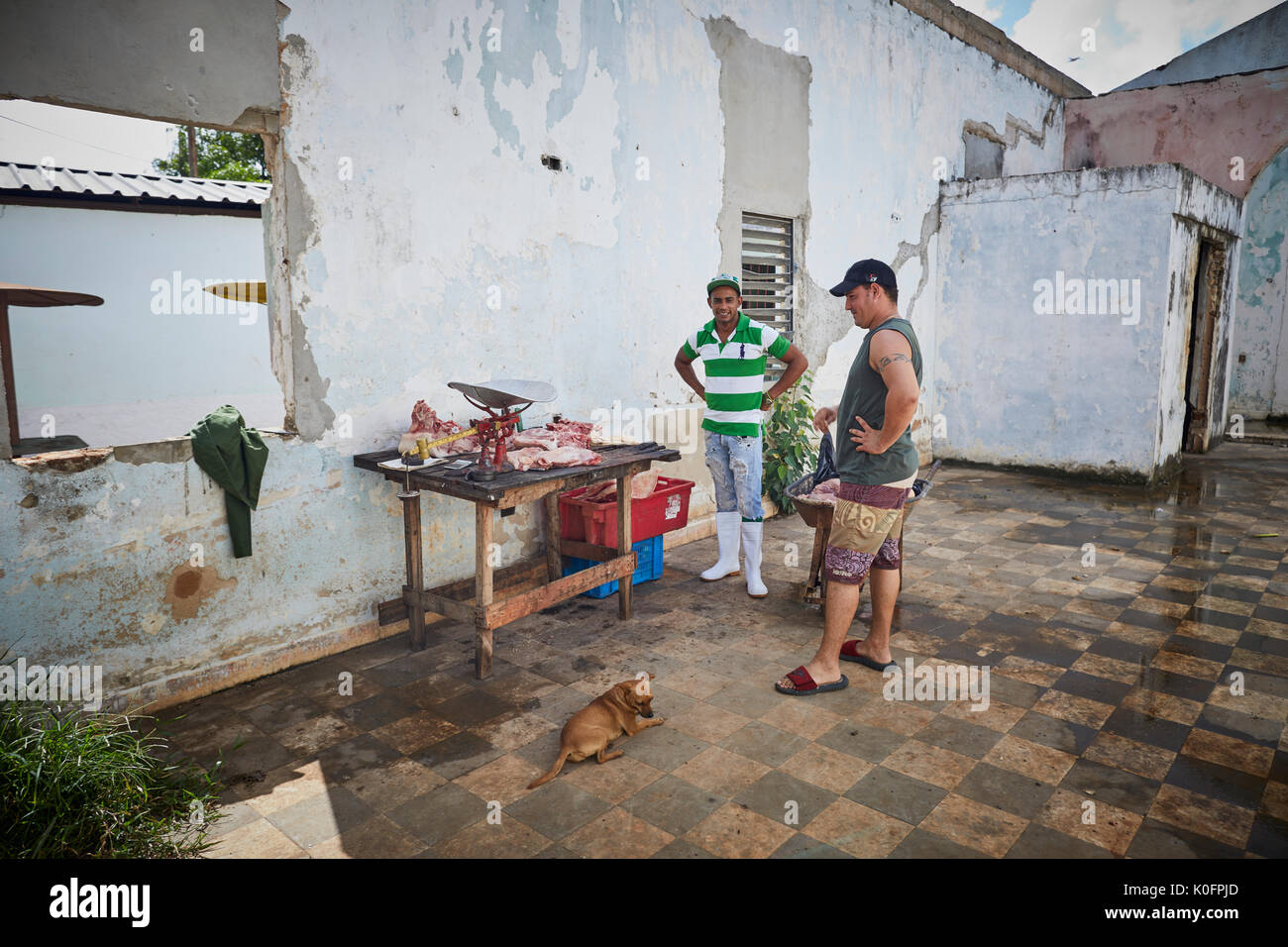 Cuban, Cuba, Cardenas, local butcher selling meat from a run down shop ...