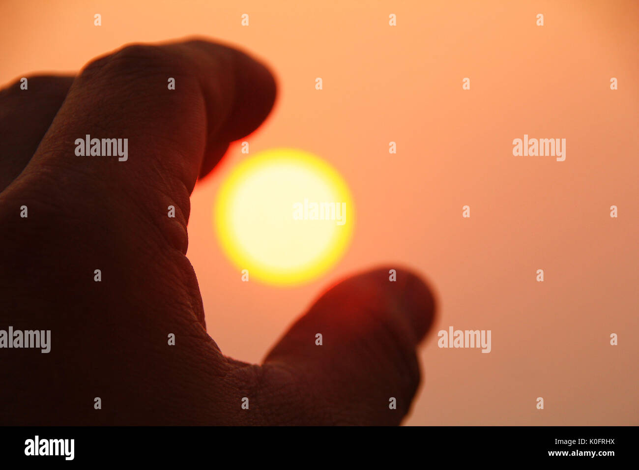 Silhouette someone holding the sun in their hand, Show that they can do ...