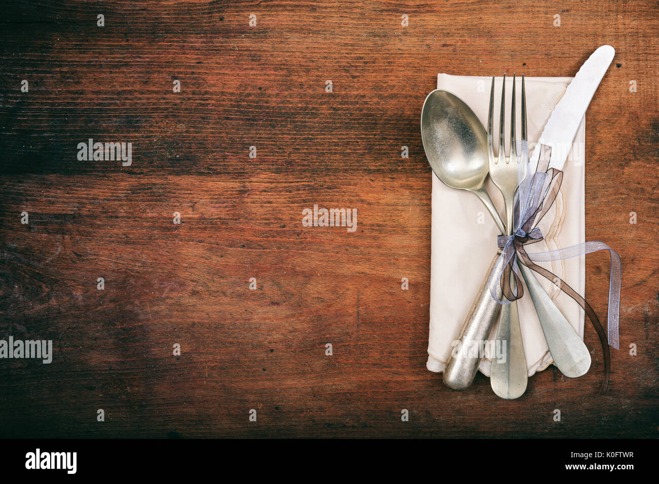 Table setting with fork, spoon and knife on wooden background Stock ...