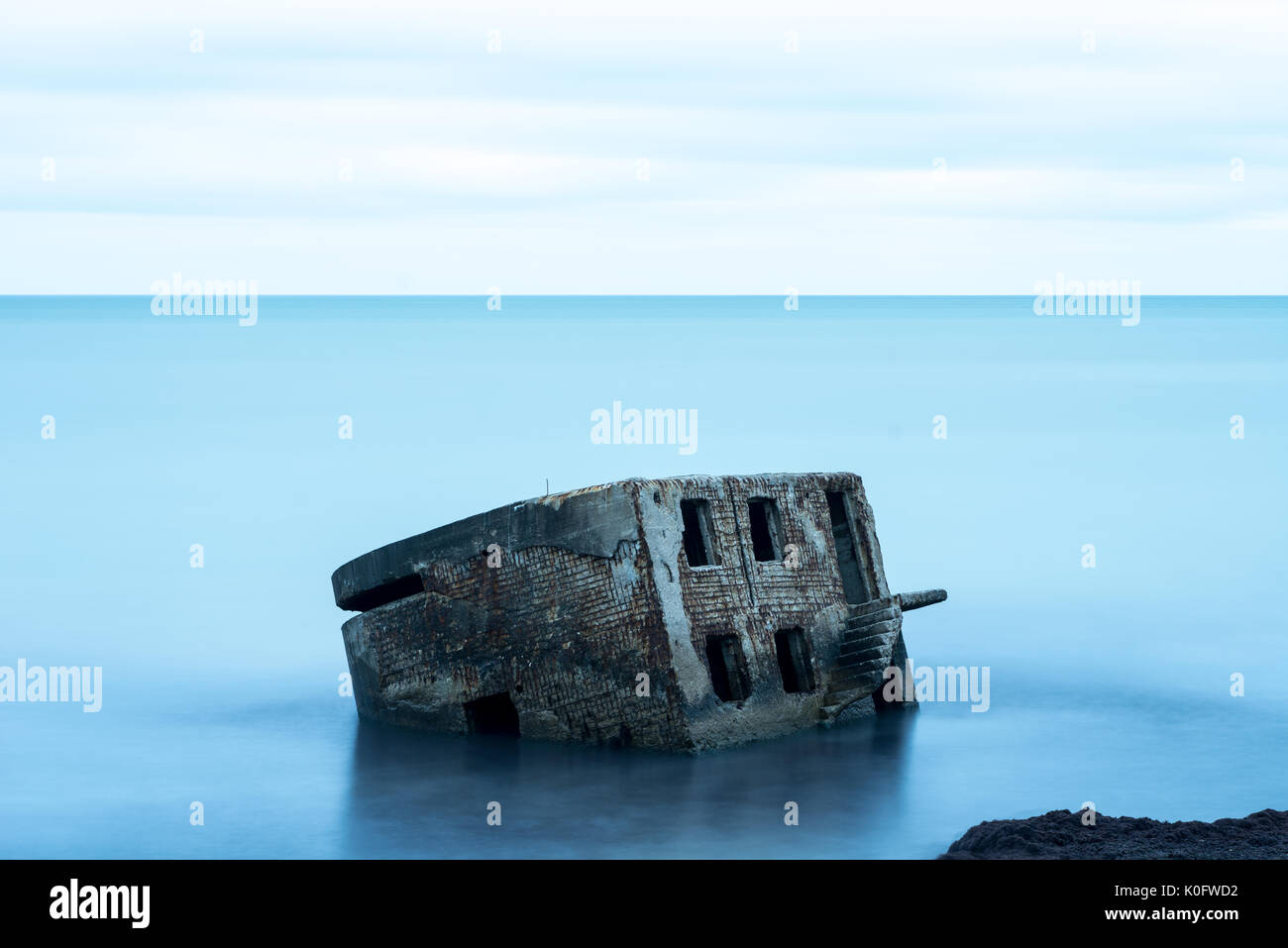 Liepaja beach bunker. Brick house, soft water, waves and rocks ... Liepaja beach bunker. Brick house, soft water, waves and rocks ...