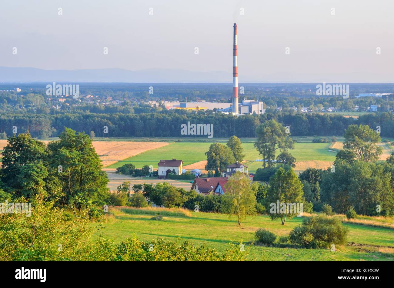 Summer countryside industrial landscape. Homes in the countryside and ...