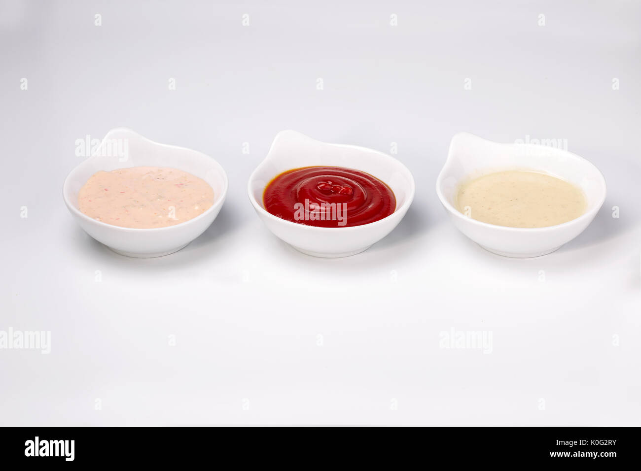 Close up photo of three different dipping dressing sauces Stock Photo ...