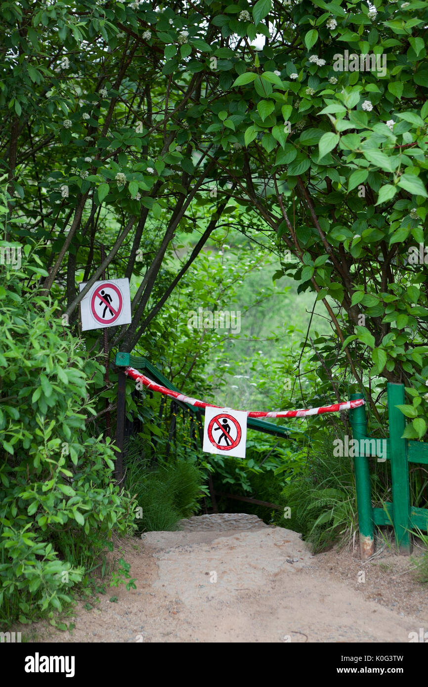 Signs with signs passage forbidden, descent the stairs down among the ...