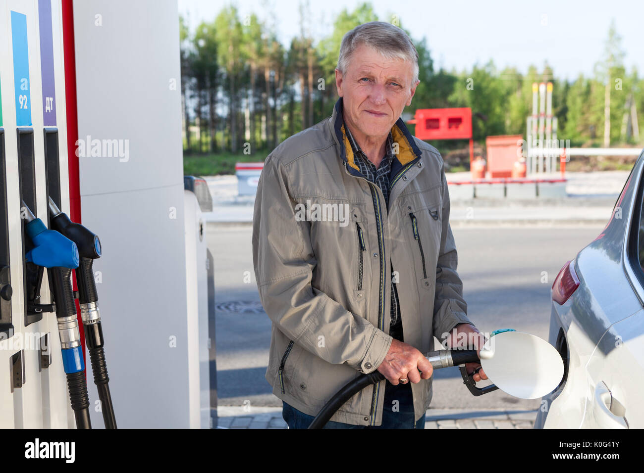 Elderly man at petrol station hi-res stock photography and images - Alamy
