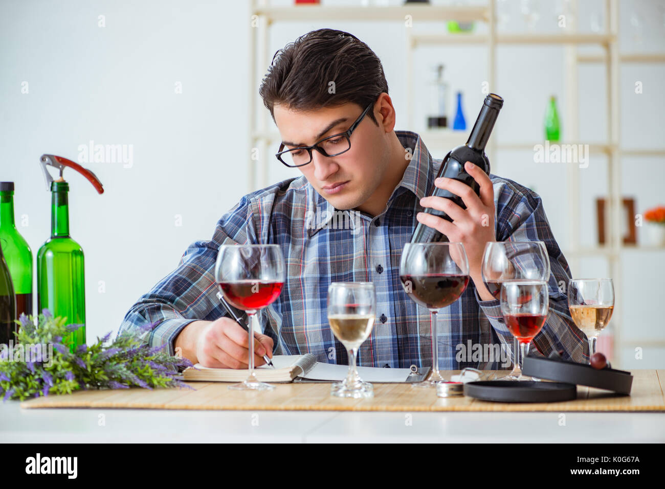 Professional sommelier tasting red wine Stock Photo - Alamy