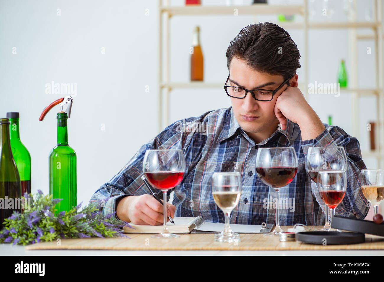 Professional sommelier tasting red wine Stock Photo - Alamy