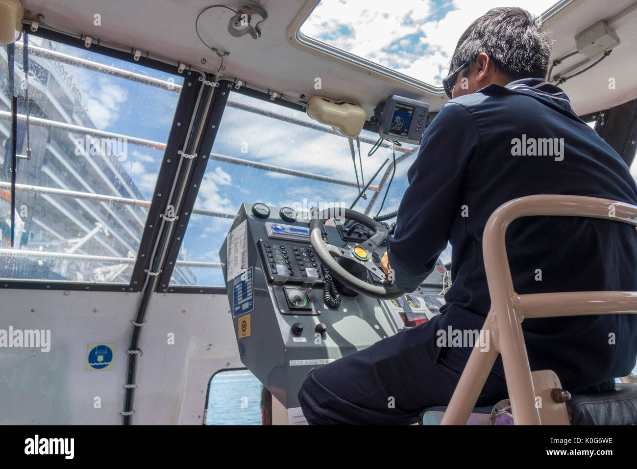 Holland America Seaman Driving A Tender Lifeboat Ferrying Passengers To ...