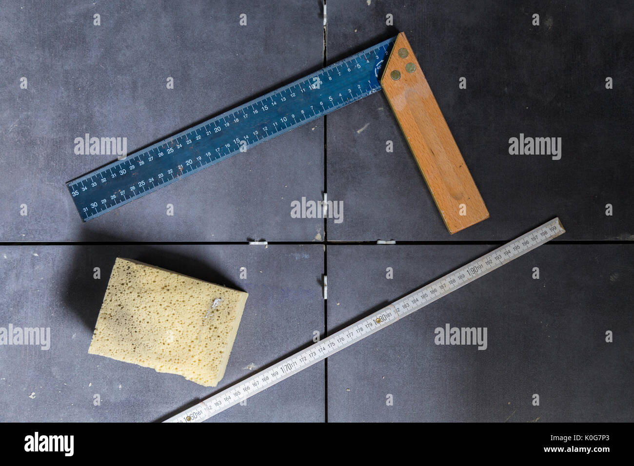 Tiles concept tool, angle, ruler, sponge on tiles top view Stock Photo ...