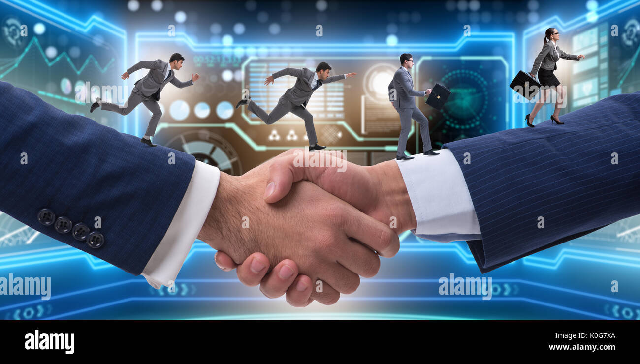 Cooperation concept with people running on handshake Stock Photo - Alamy