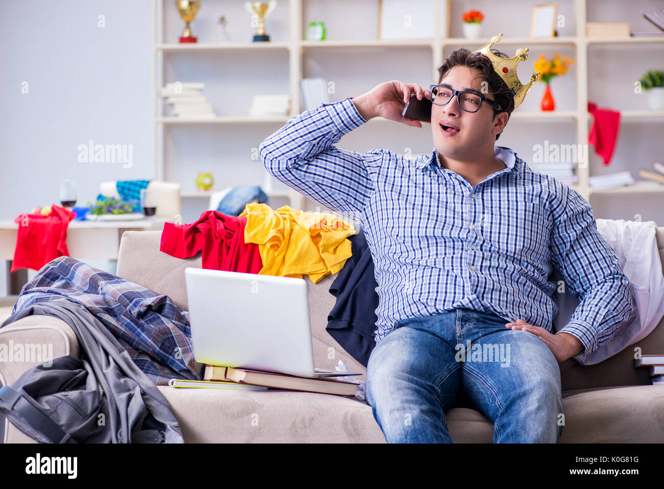 Young man working studying in messy room Stock Photo - Alamy