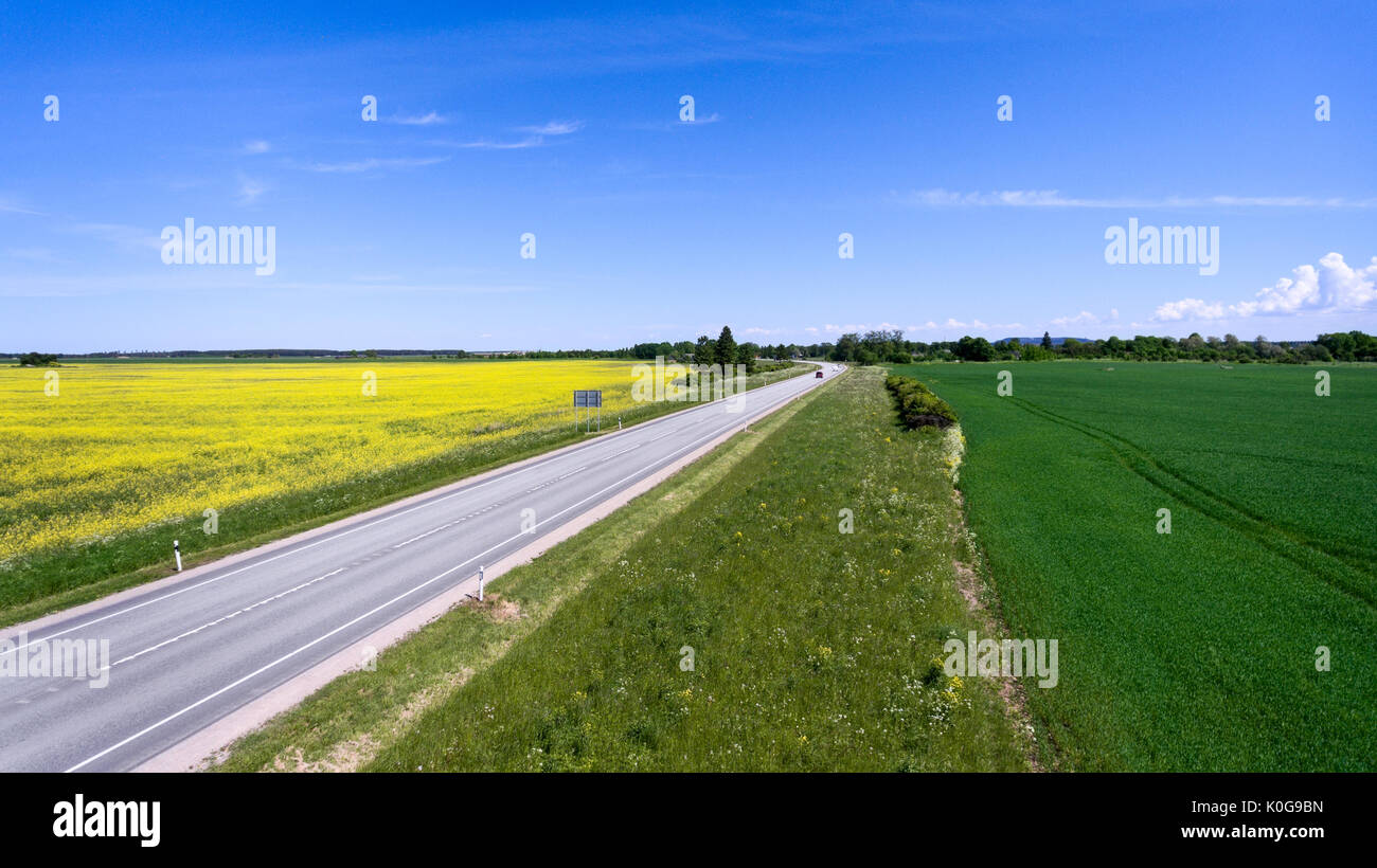 Above view over yellow raps fields and the European E20 route ...
