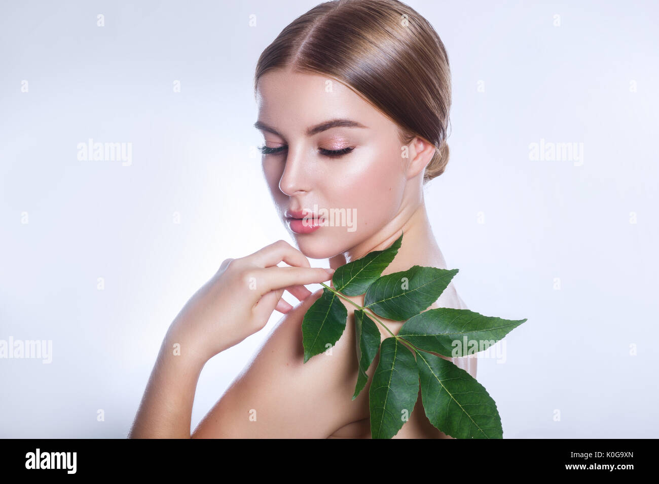 Beautiful Woman Face Portrait With Green Leaf Concept For Skin Care