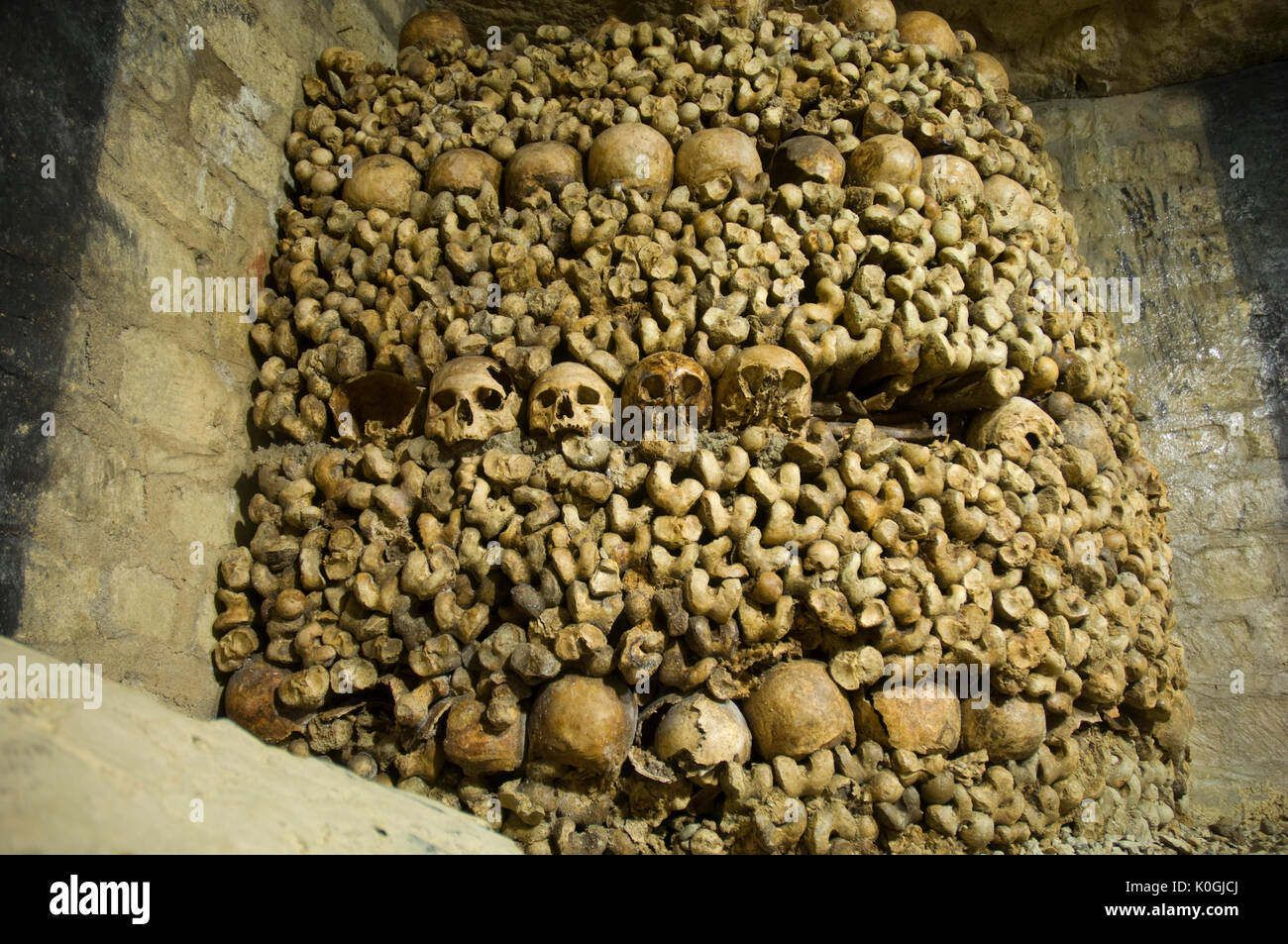 Human skulls and bones decorate the walls of the Catacombs beneath the ...