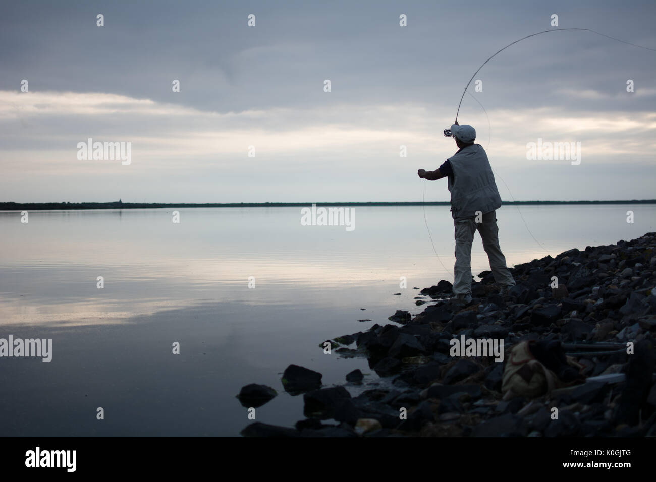 Fly fishing Oostvoorne at Sunset Stock Photo - Alamy