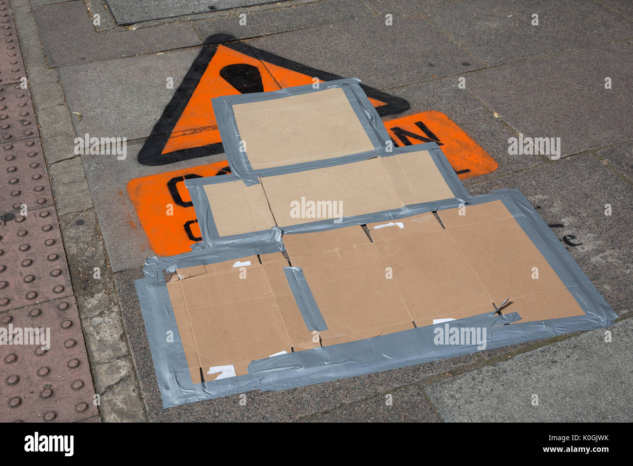 London, UK. 14th August, 2017. A protest stencil outside the offices of ...