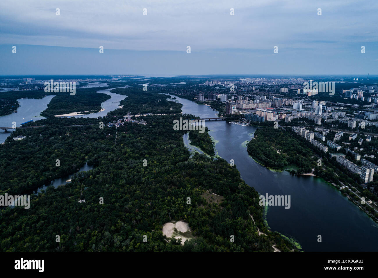 Panoramic view of the city of Kiev with the Dnieper River. A large park ...