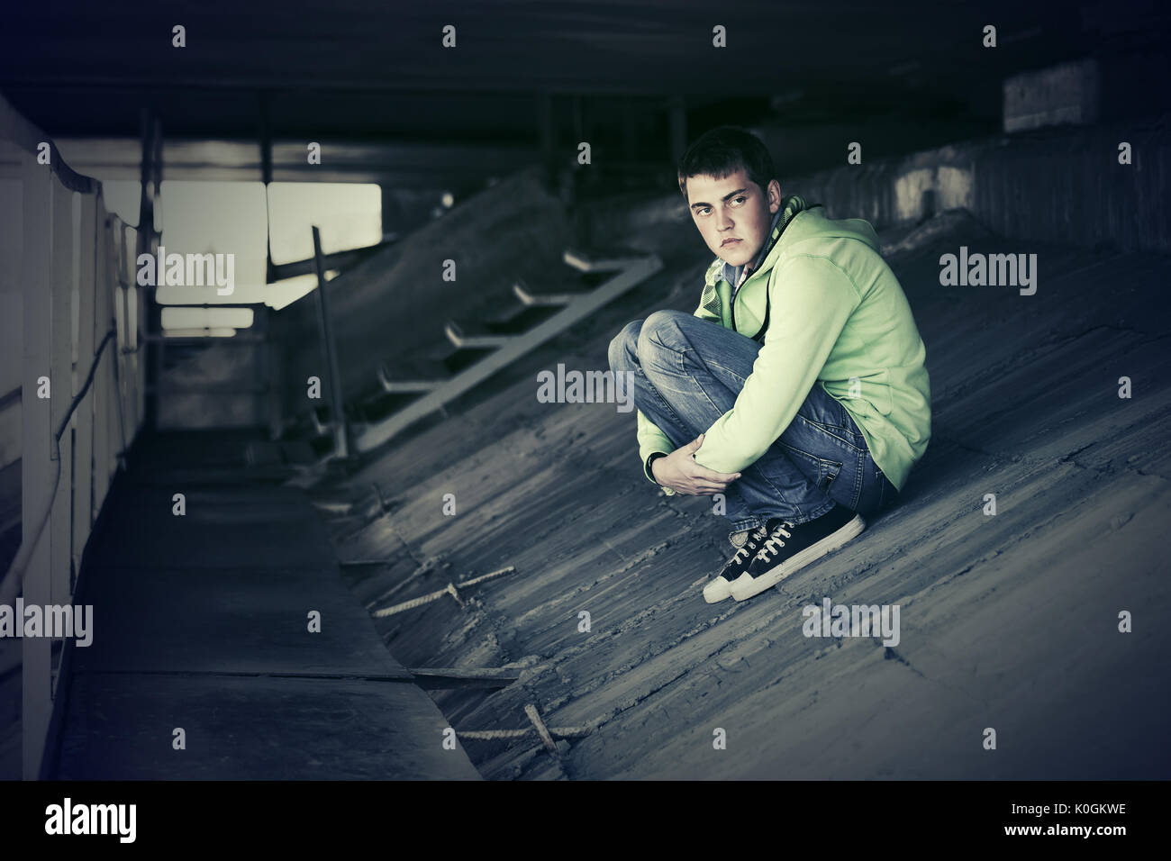 Sad young man in depression outdoor Stock Photo - Alamy