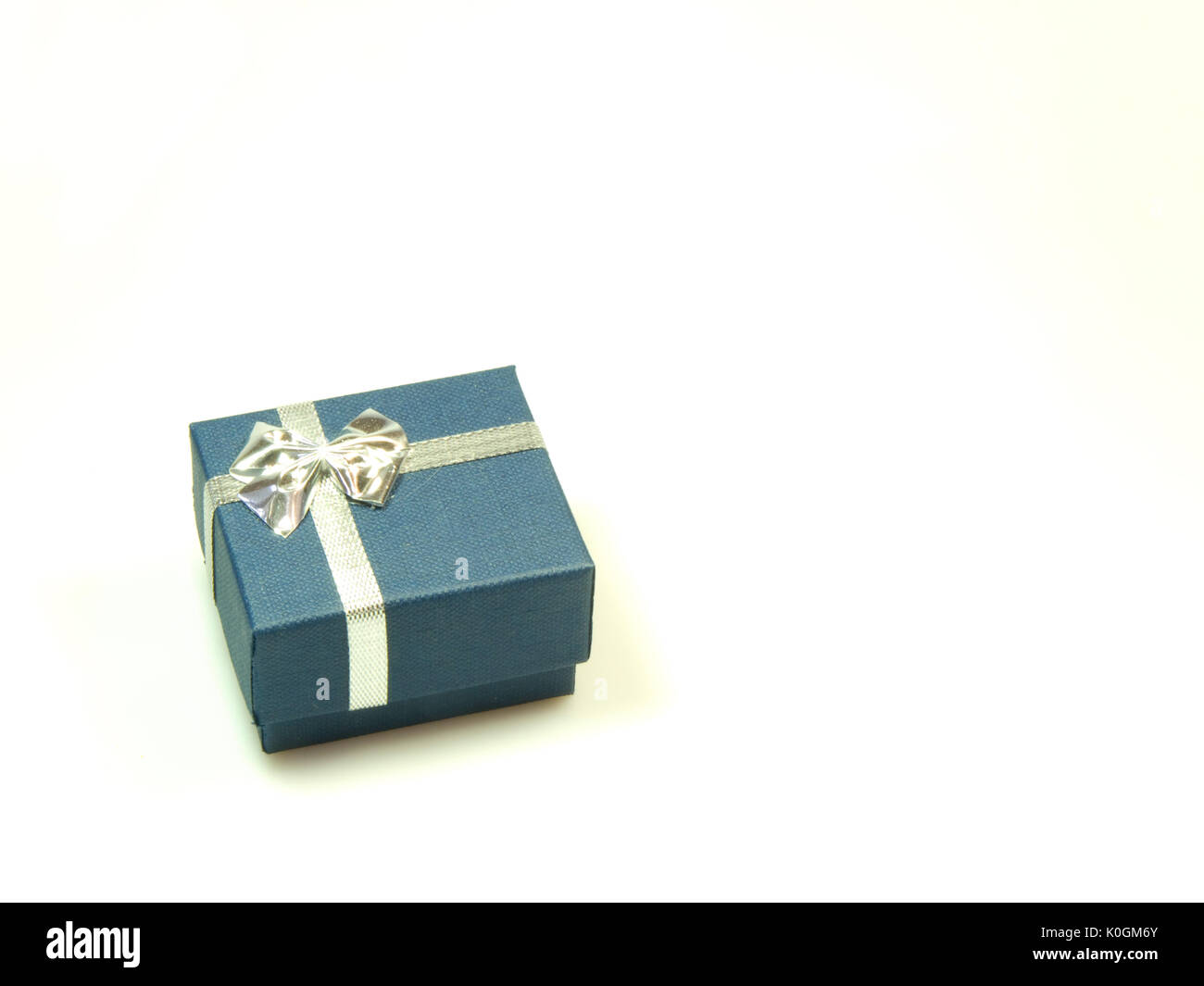 Little present wrapped in blue and silver Stock Photo - Alamy