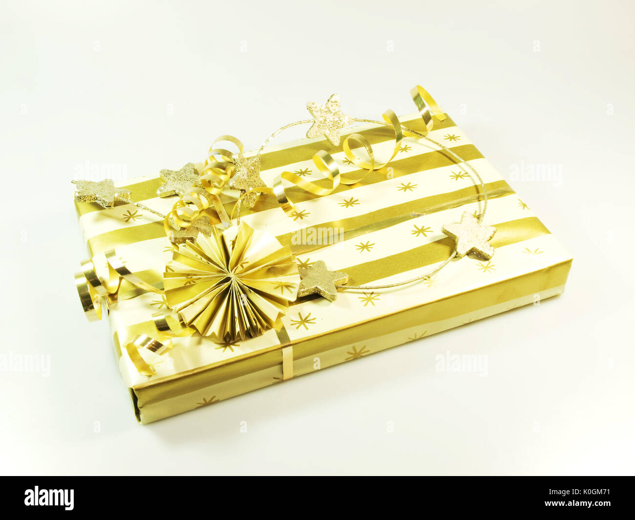 Gift box in gold and white Stock Photo - Alamy