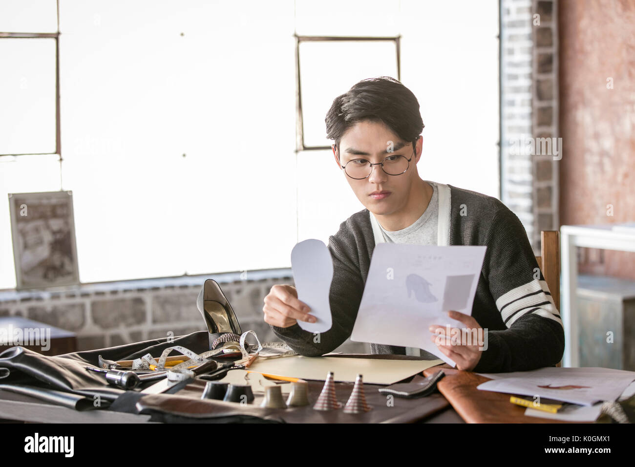 Portrait of young businessman concentrating on his work Stock Photo - Alamy