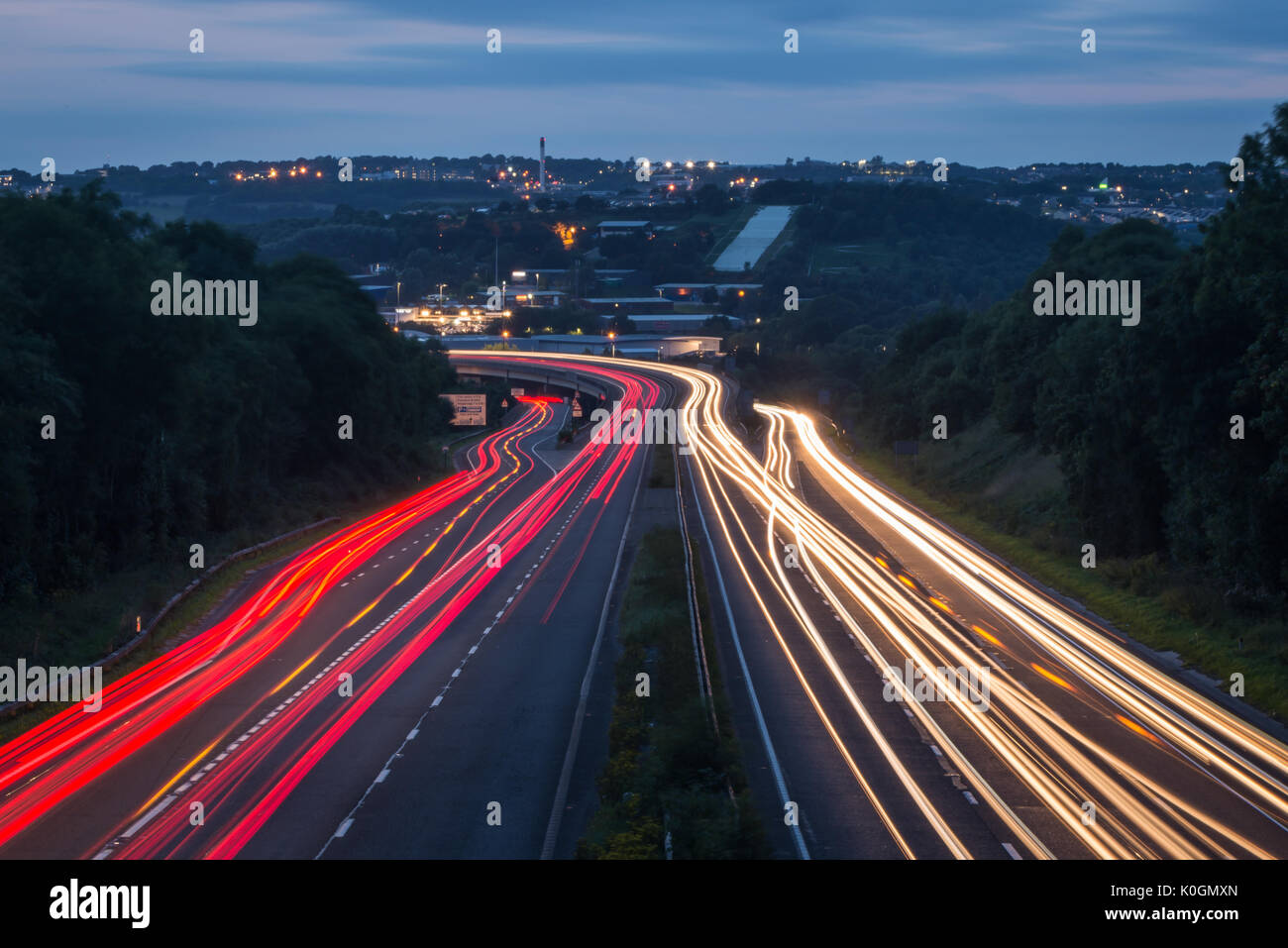 Light trails from commuters on A38 at night in Devon, UK Stock Photo ...