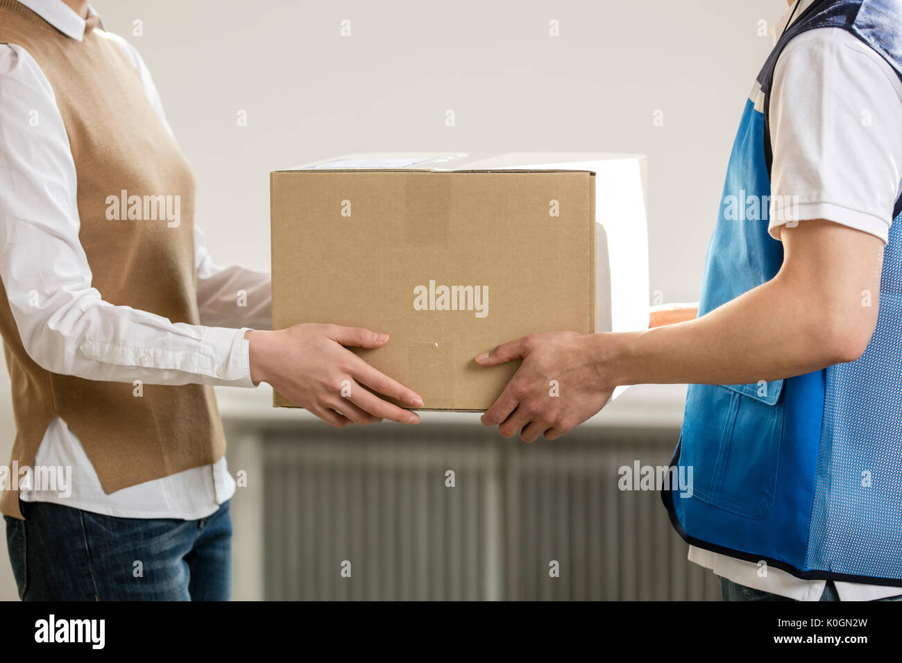 Receiving delivery asian hi-res stock photography and images - Alamy