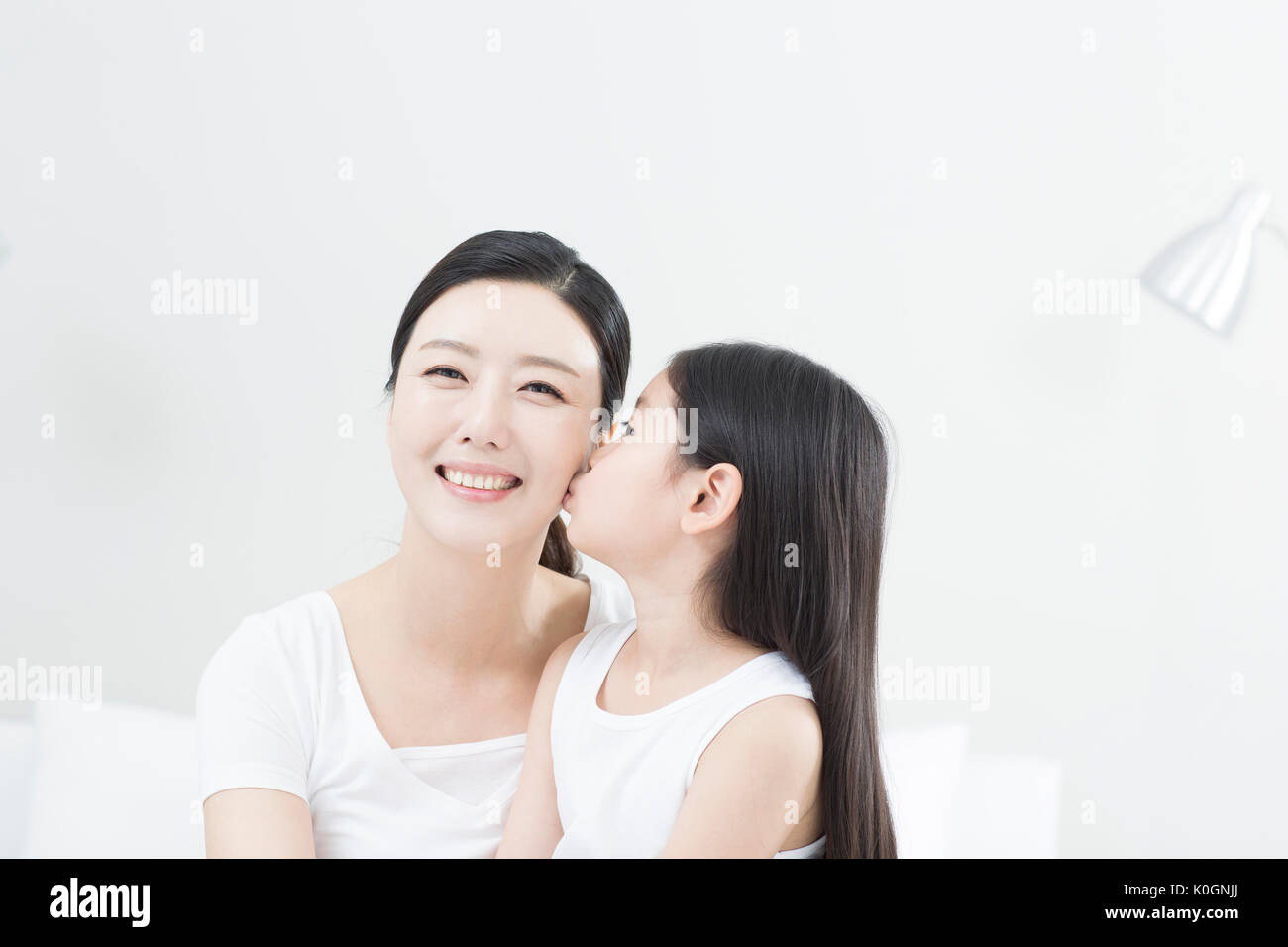 Portrait of smiling mother and daughter Stock Photo - Alamy