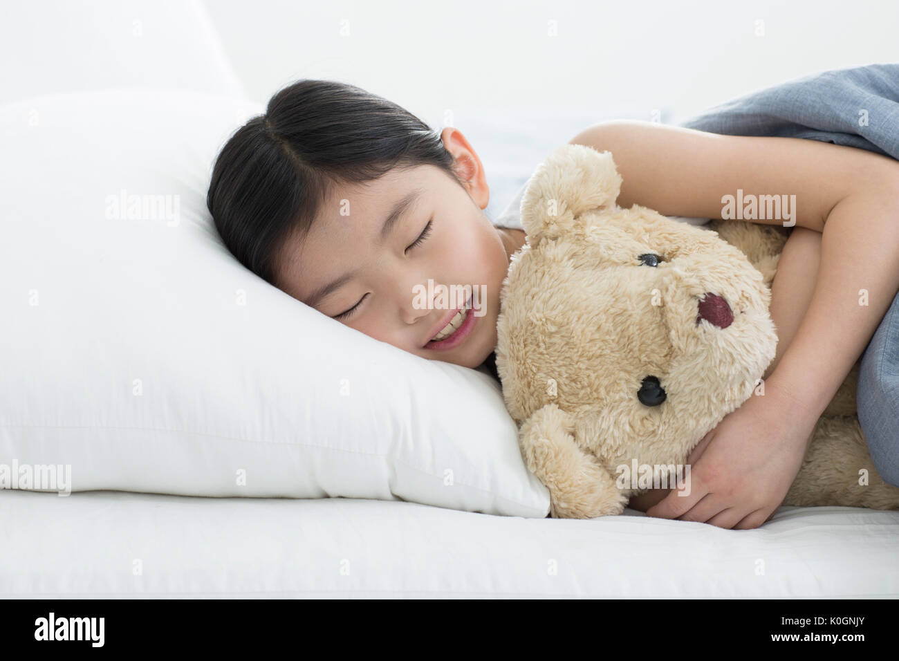 Portrait of girl with teddy bear sleeping Stock Photo - Alamy