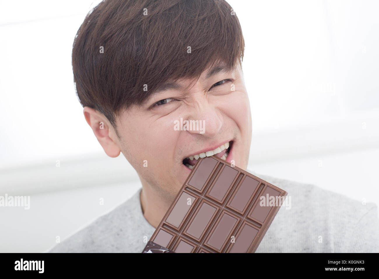 Man eating chocolate hi-res stock photography and images - Alamy