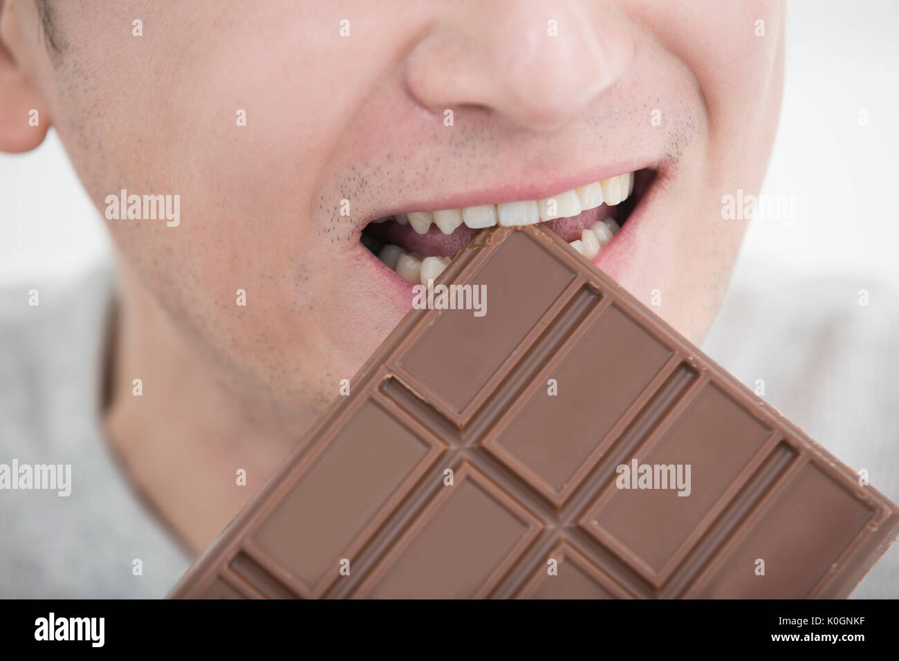 Man eating chocolate hi-res stock photography and images - Alamy