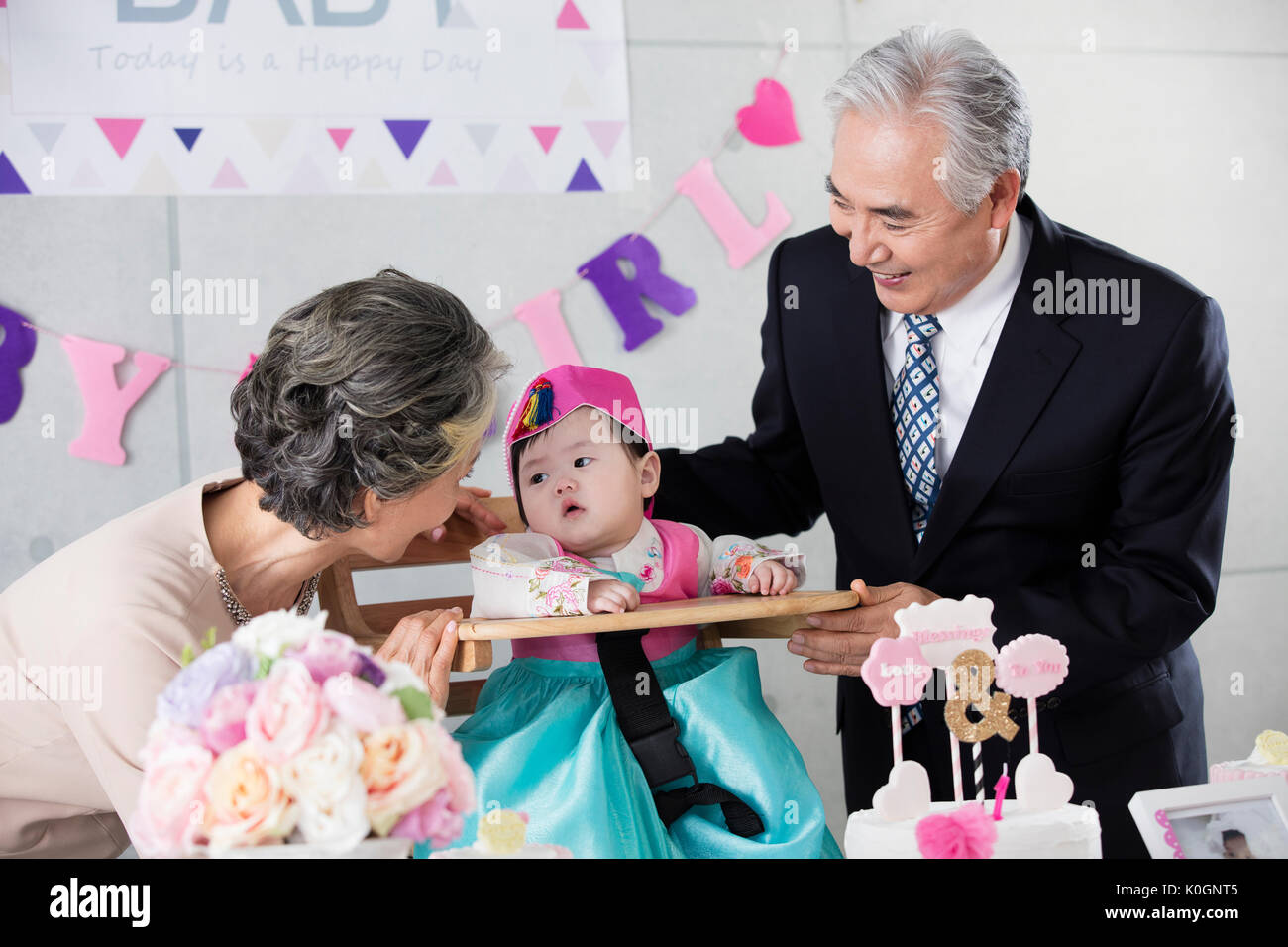 Loving grandparents and baby girl at first birthday party Stock Photo ...