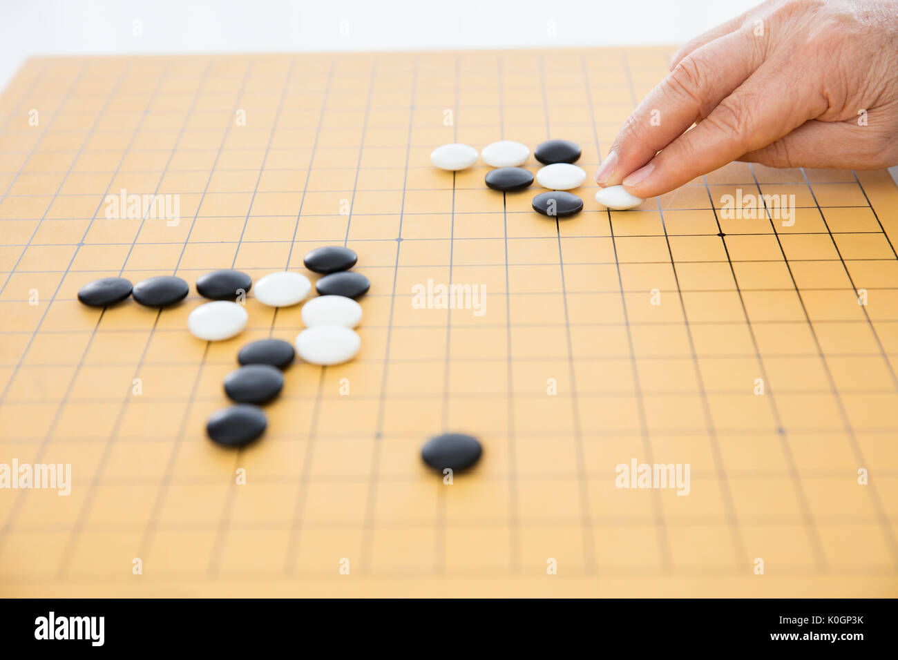 Playing go board game hi-res stock photography and images - Alamy