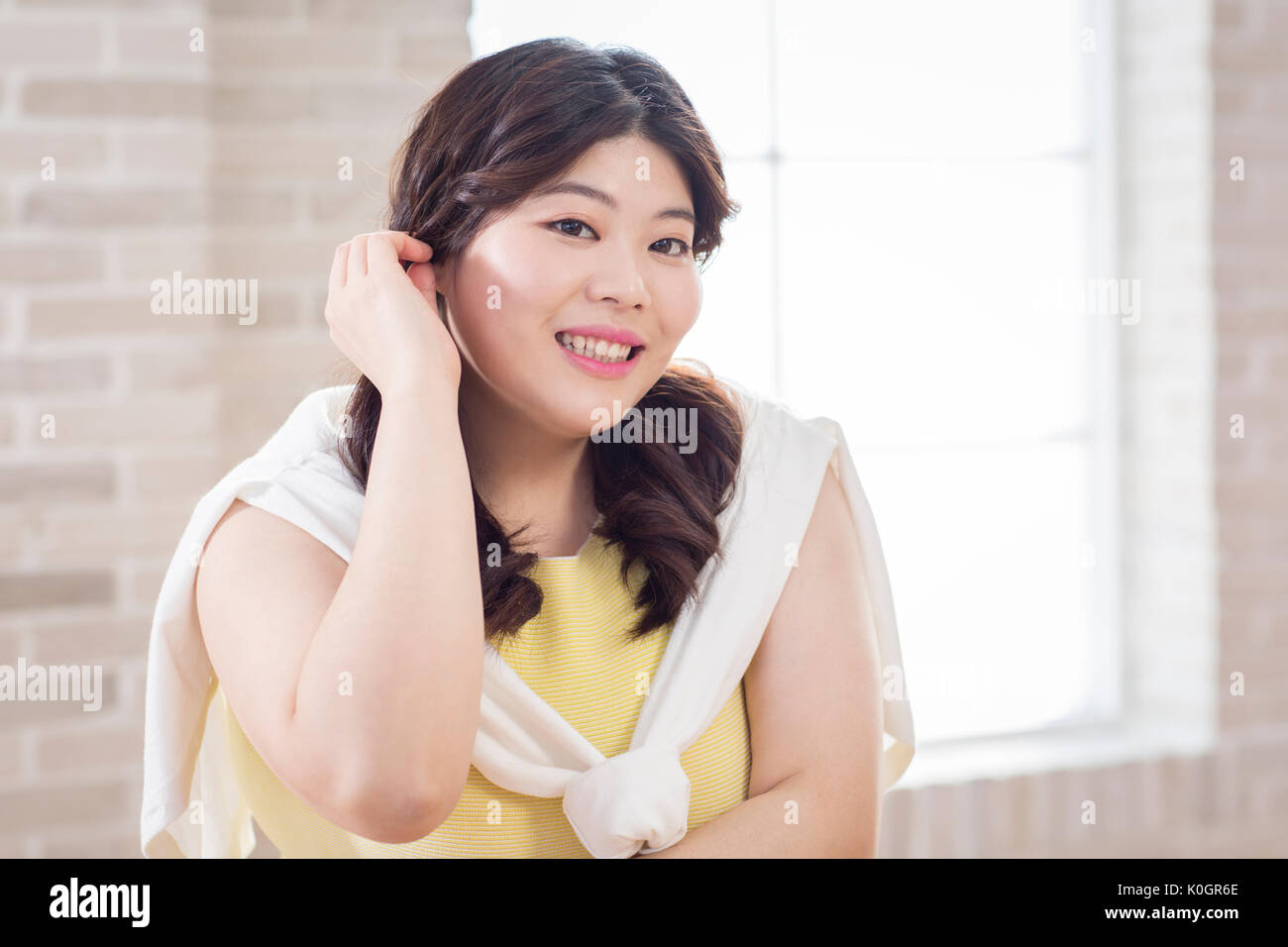 Portrait of young smiling fat woman Stock Photo - Alamy