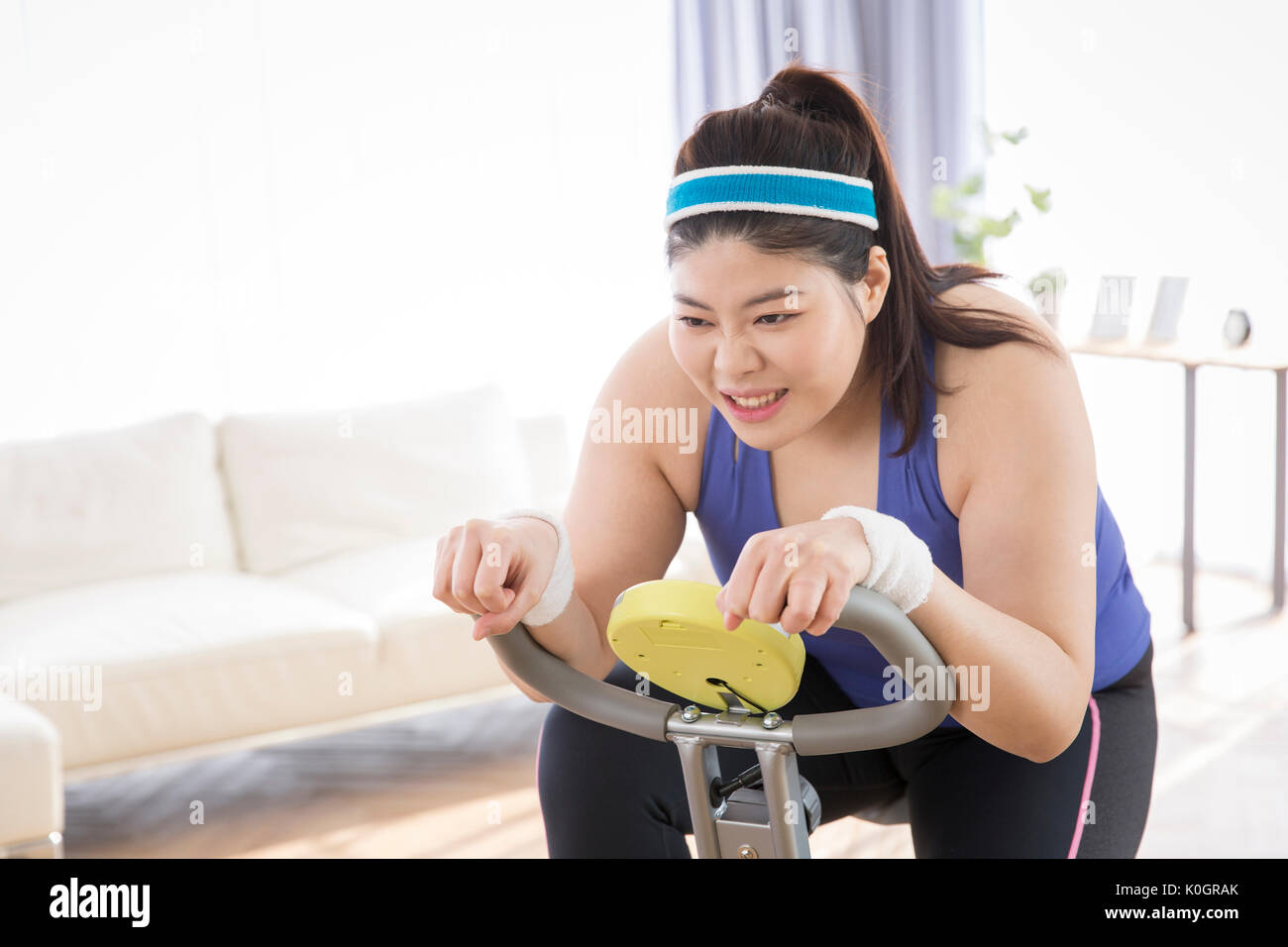 Young fat woman exercising hard Stock Photo - Alamy