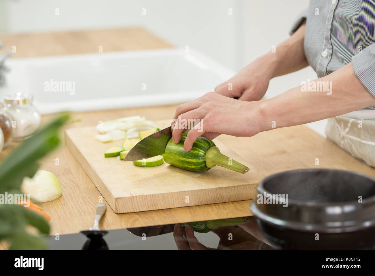 Single man cooking Stock Photo - Alamy