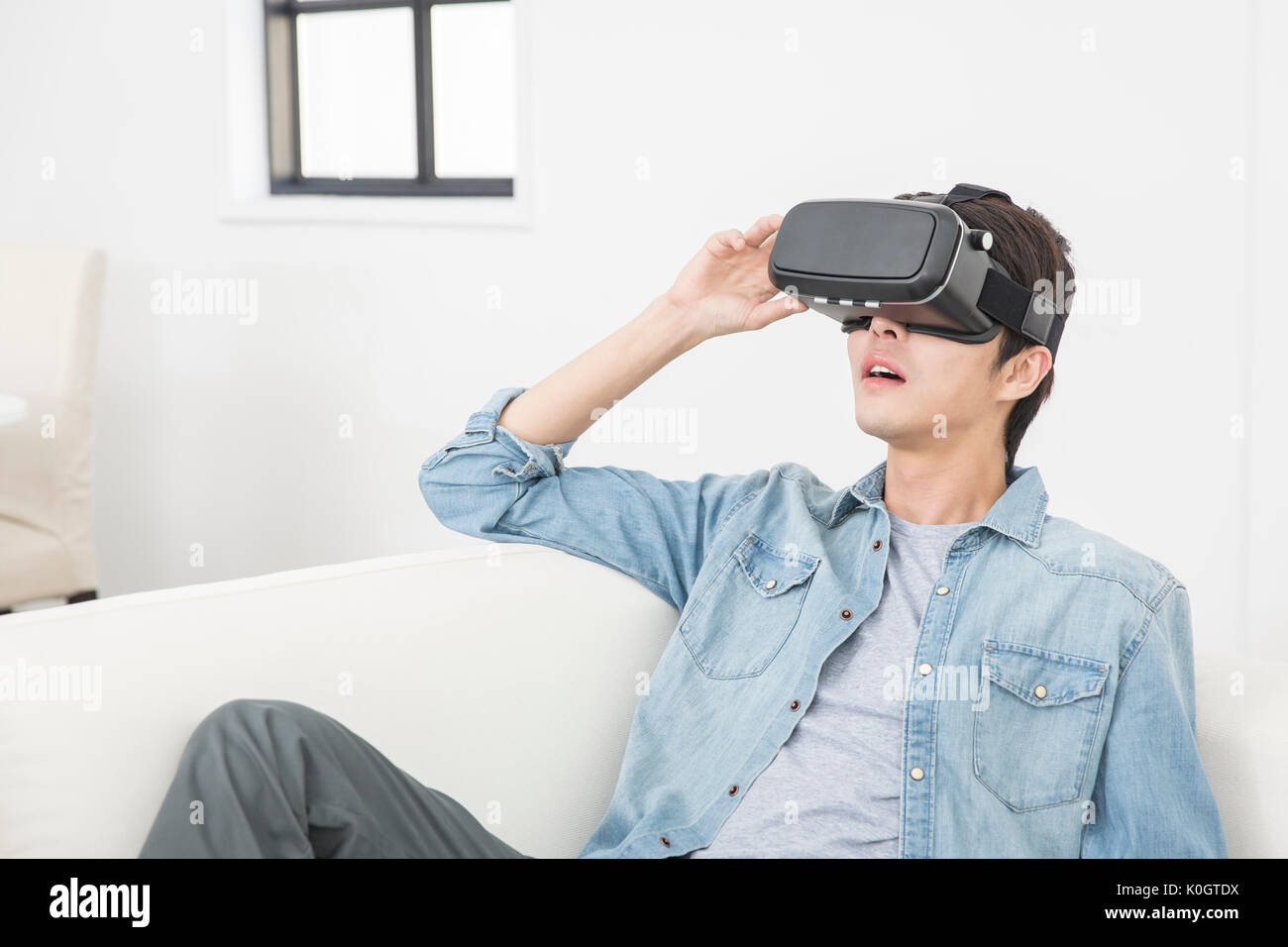 Side view of man with virtual reality headset Stock Photo - Alamy