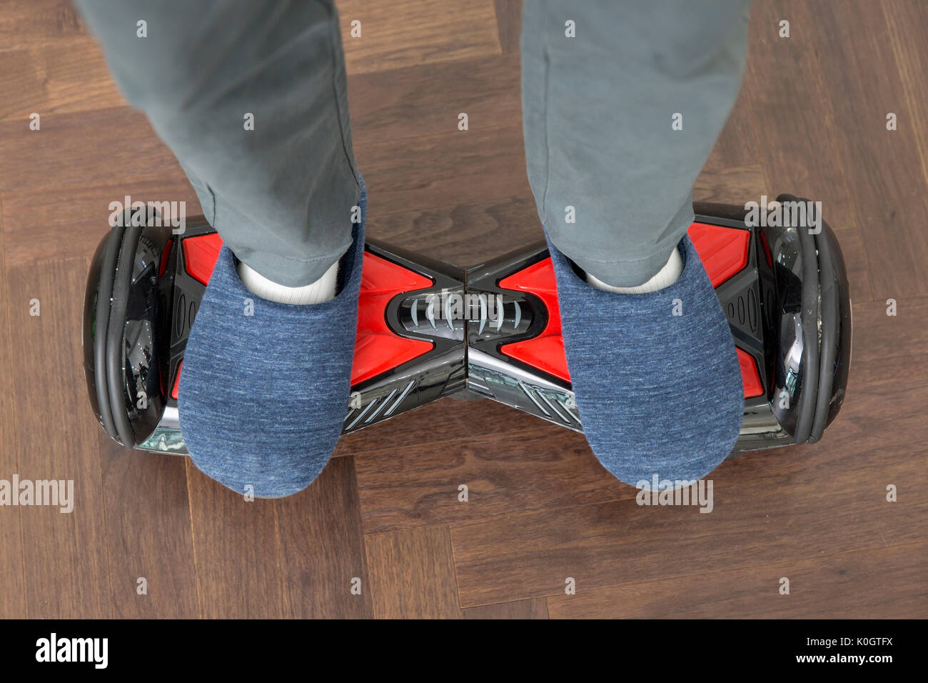 Man standing on a segway scooter Stock Photo - Alamy