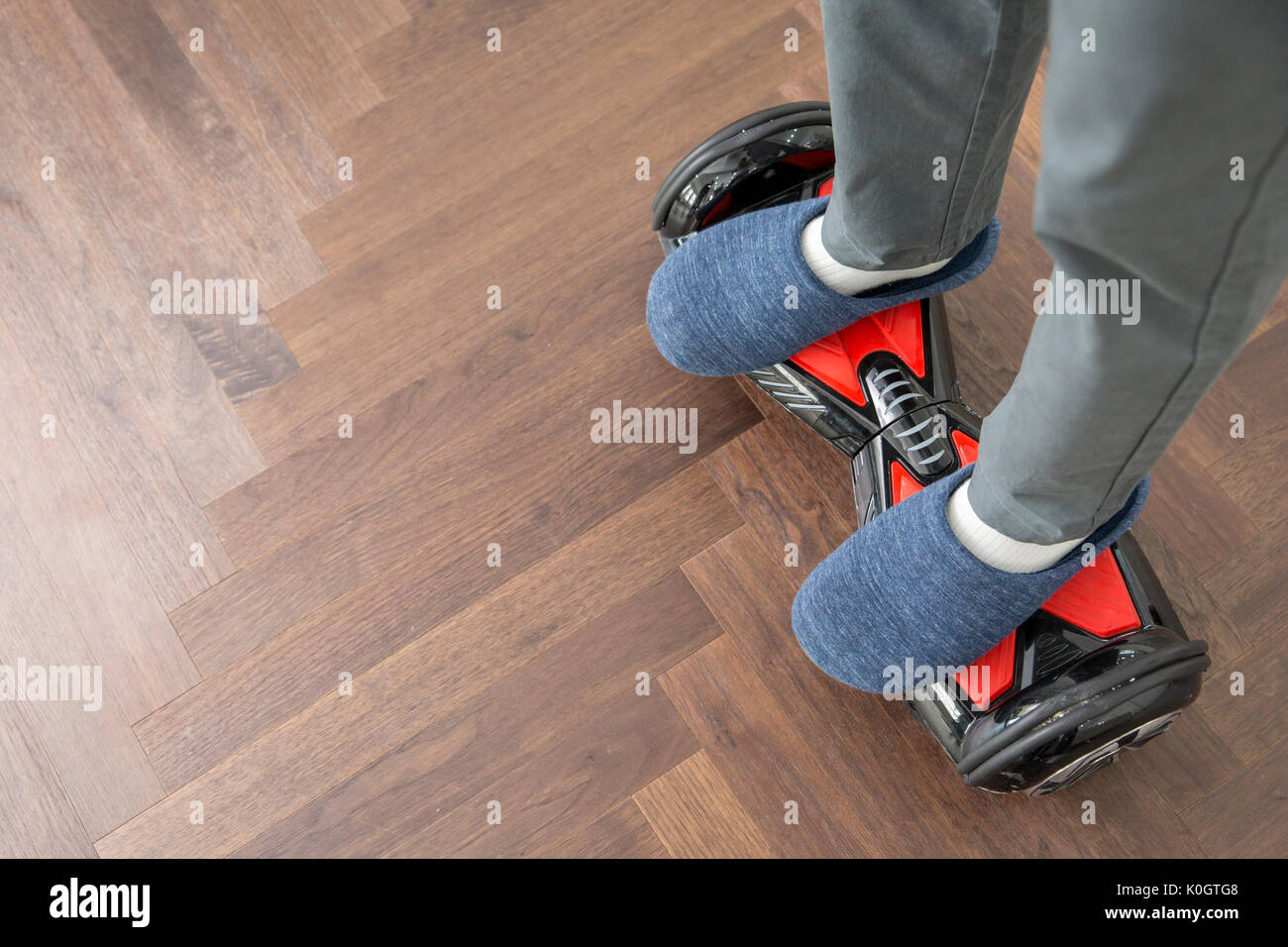 Man standing on a segway scooter Stock Photo - Alamy