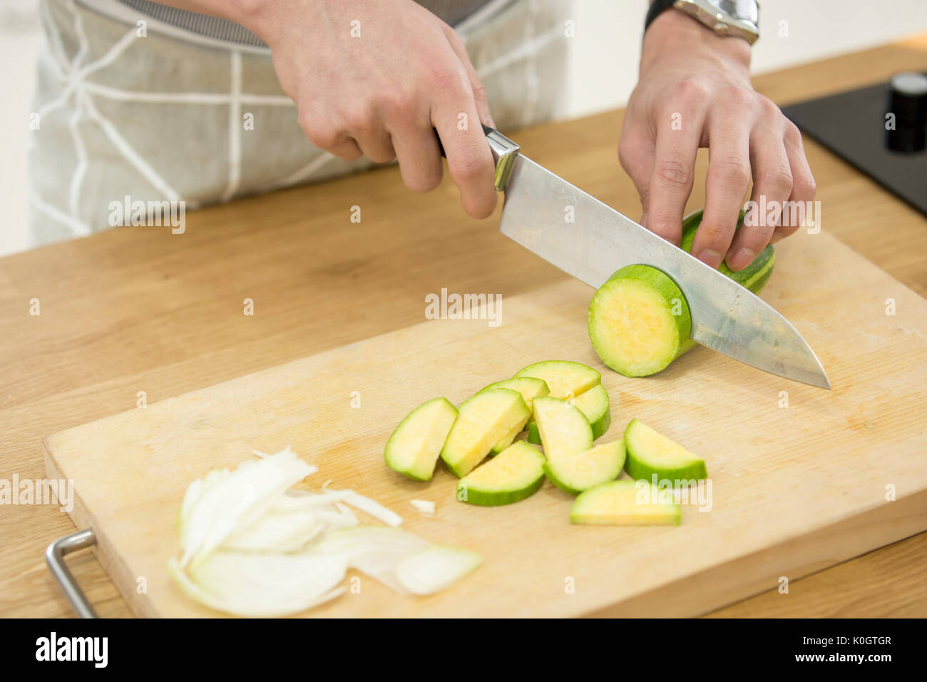 Single man cooking Stock Photo - Alamy