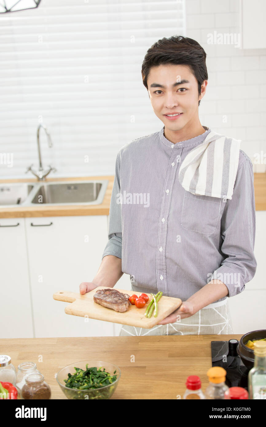 Smiling adult man cutting hi-res stock photography and images - Alamy