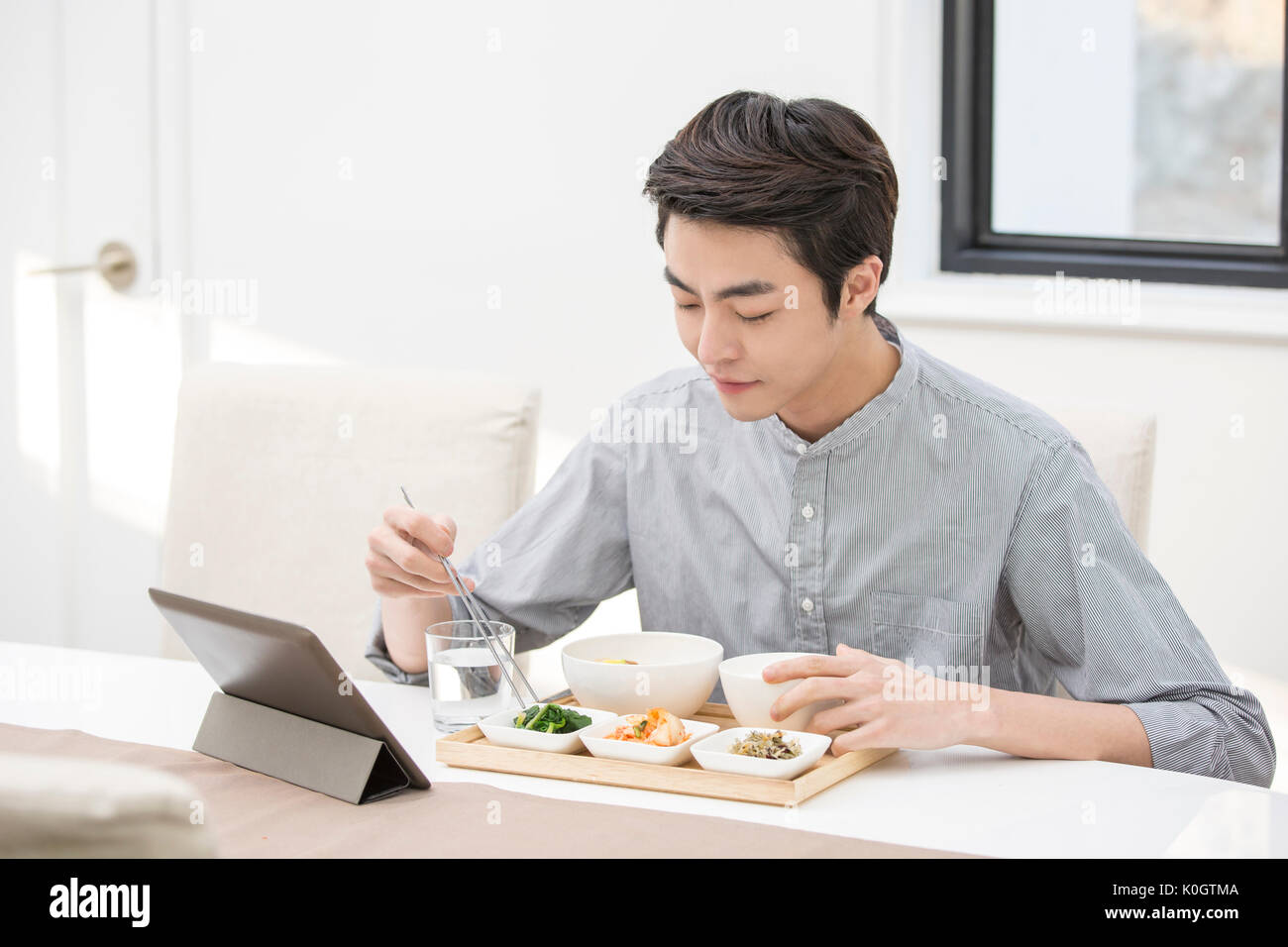 Portrait of single man having a meal alone Stock Photo - Alamy