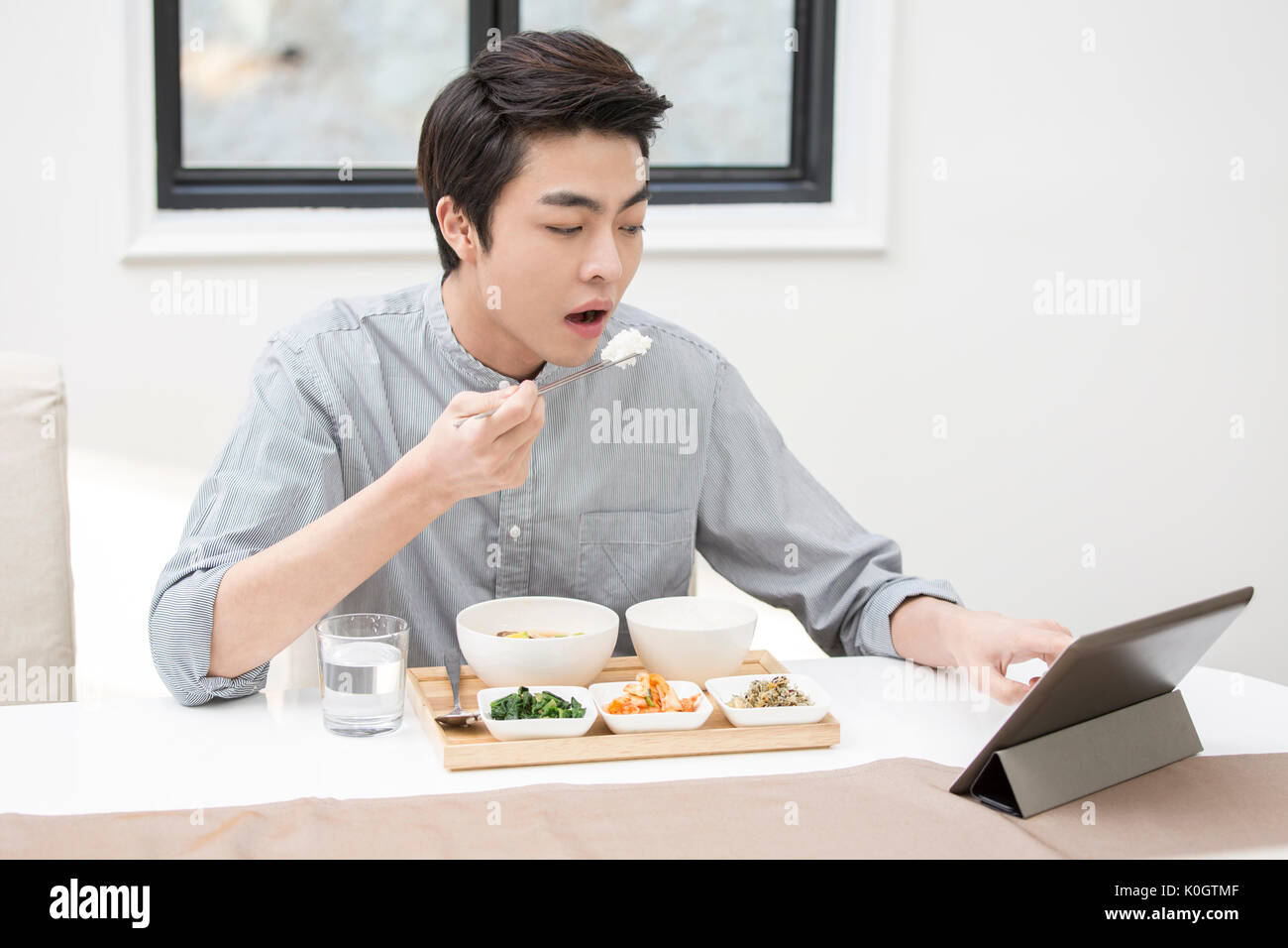Asian man eating rice chopsticks hi-res stock photography and images ...