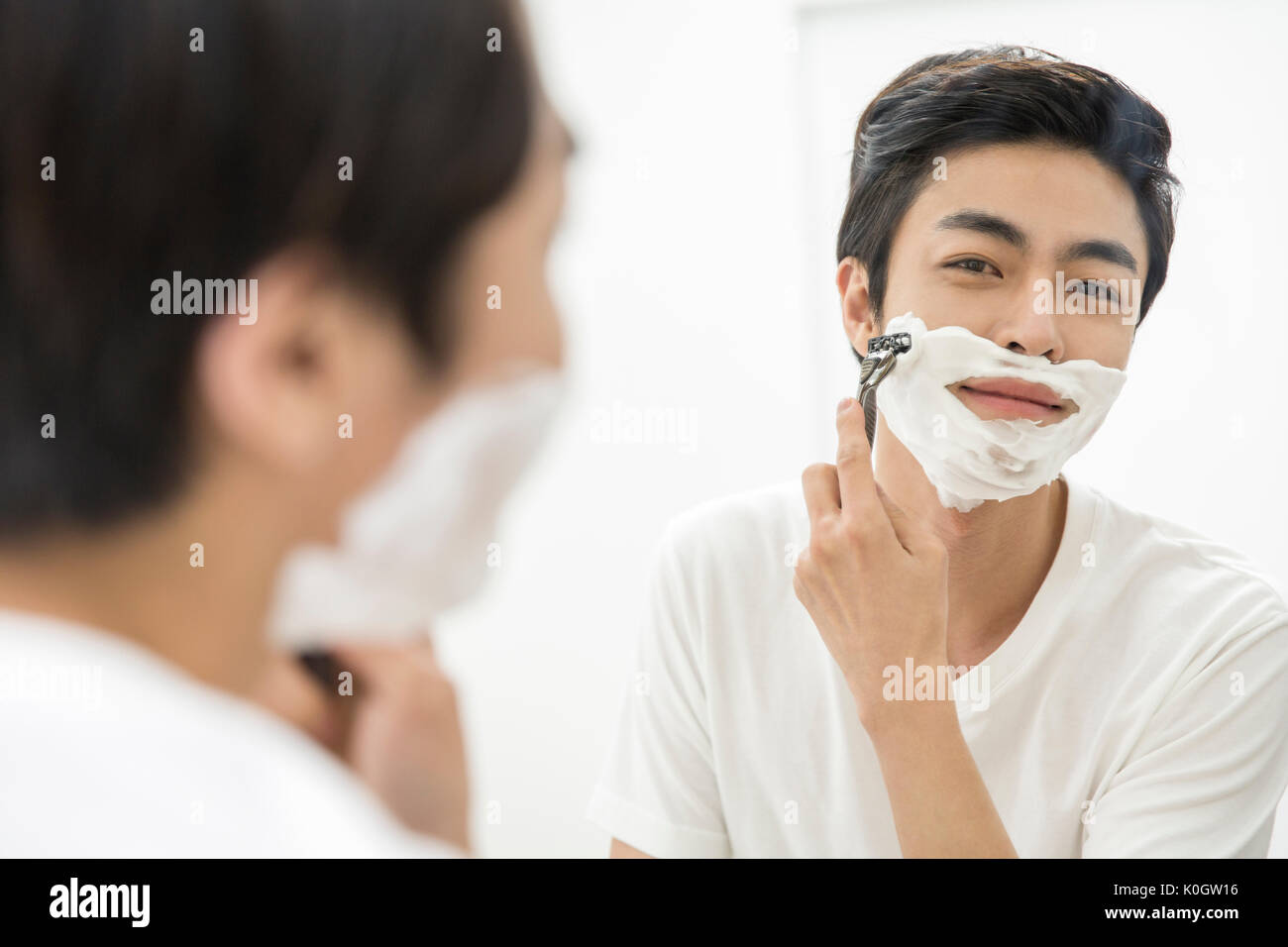 Portrait of grooming shaving his face Stock Photo - Alamy